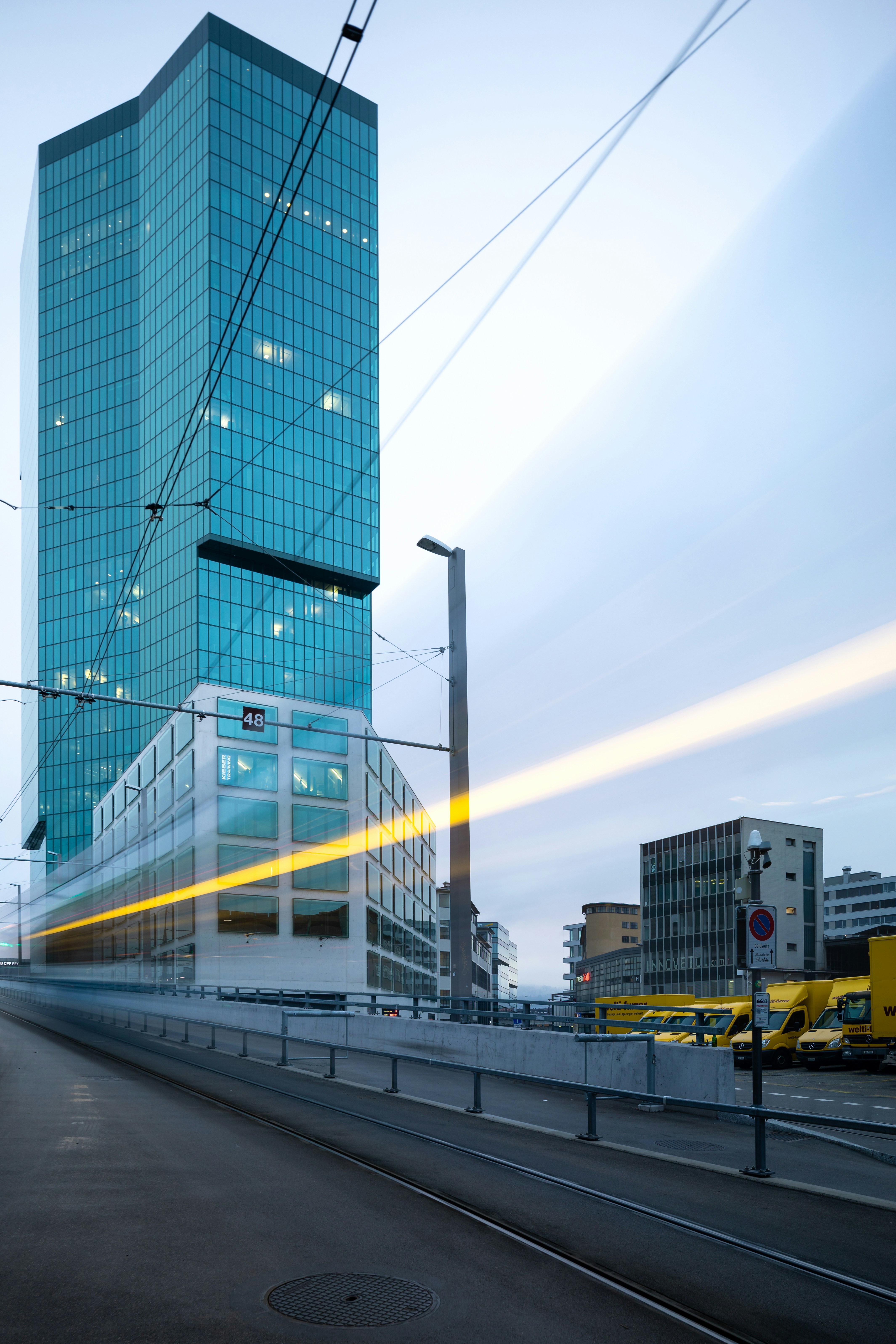 Time lapse photography of blue high-rise building during daytime photo ...
