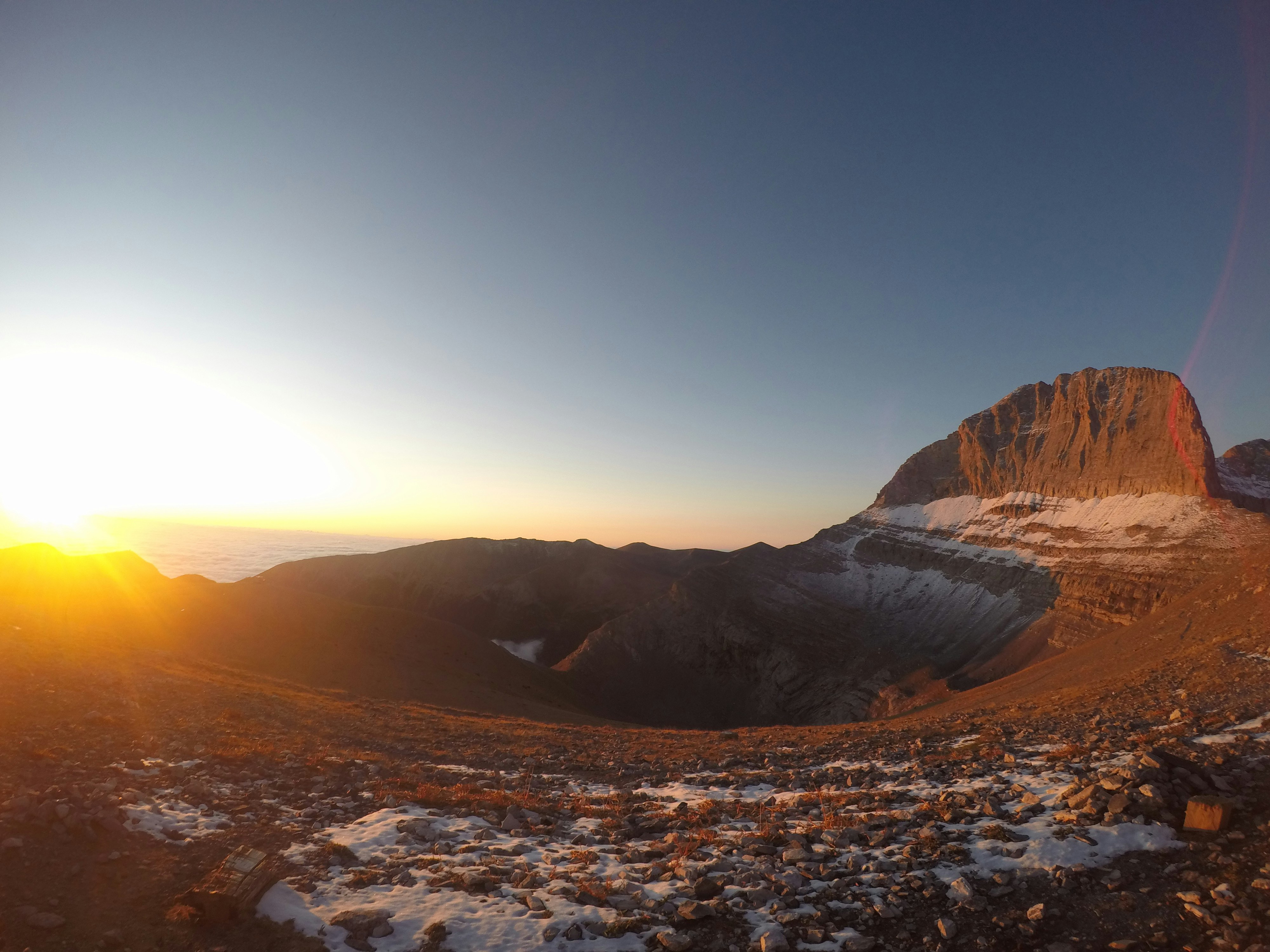 Sunrise Over Rugged Peak: A Quiet Dawn on Alpine Soil