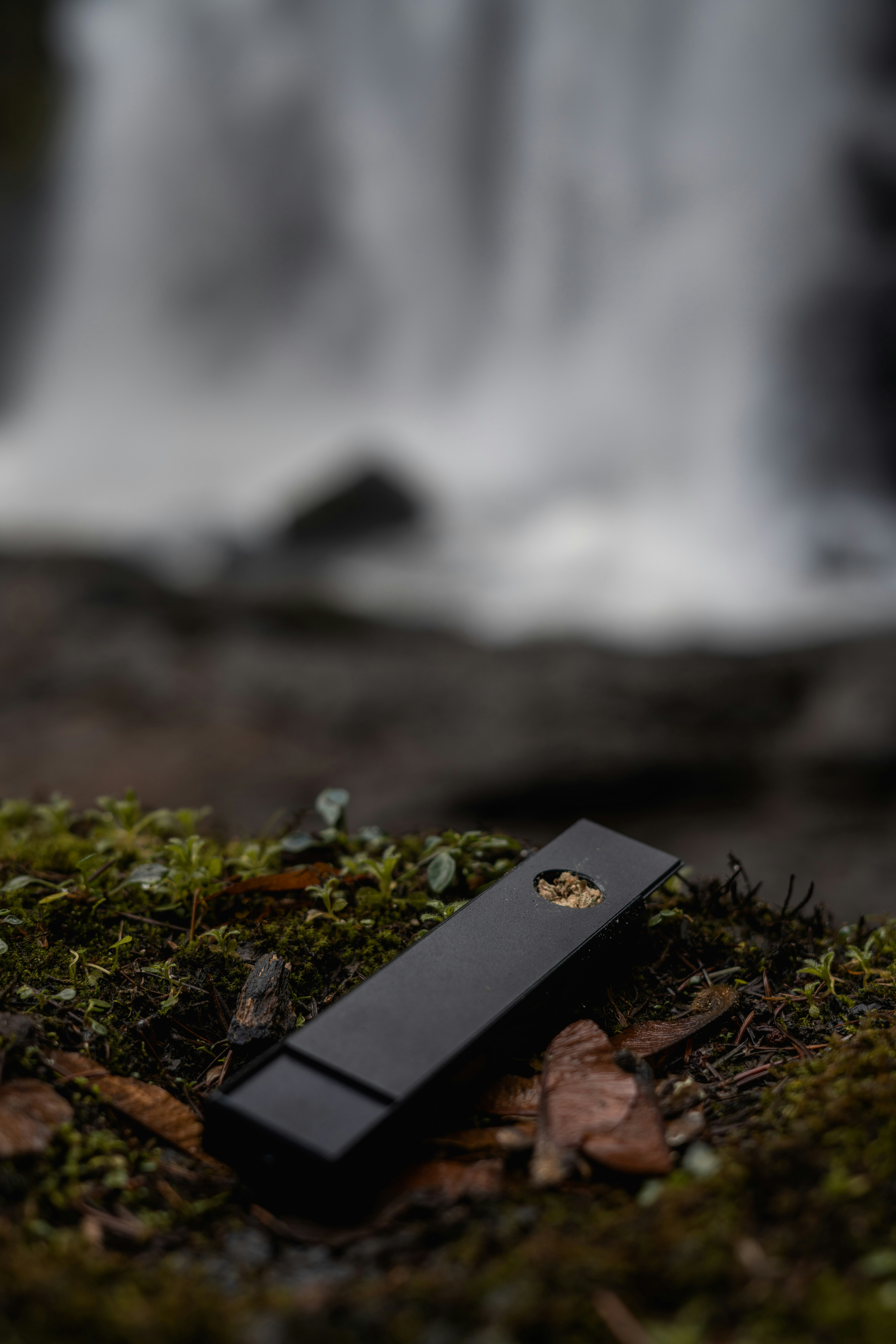 Gray vaporizer pen on ground photo – Free Waterfall Image on Unsplash