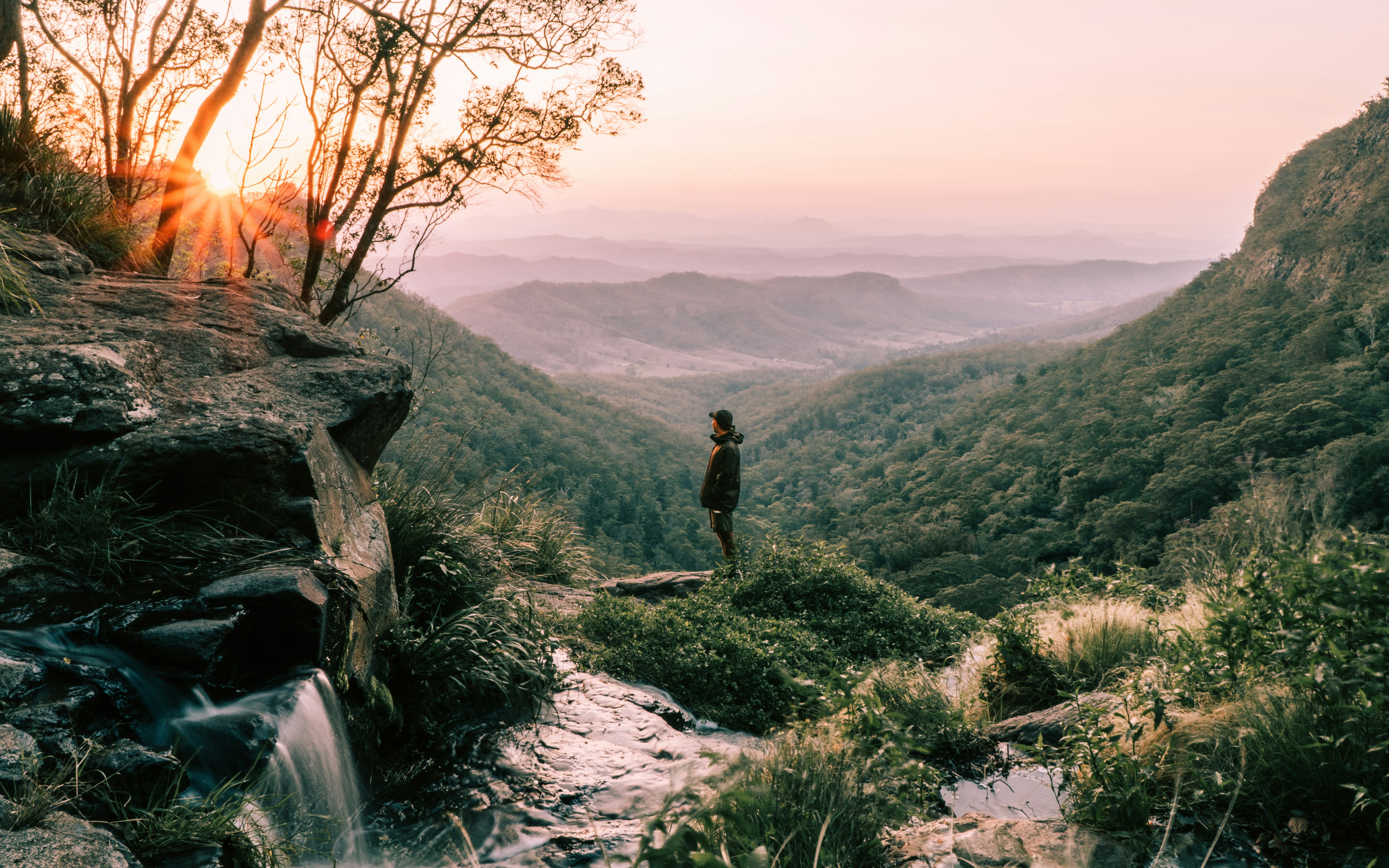 Scale. @lochieriordan | woman standing near cliff