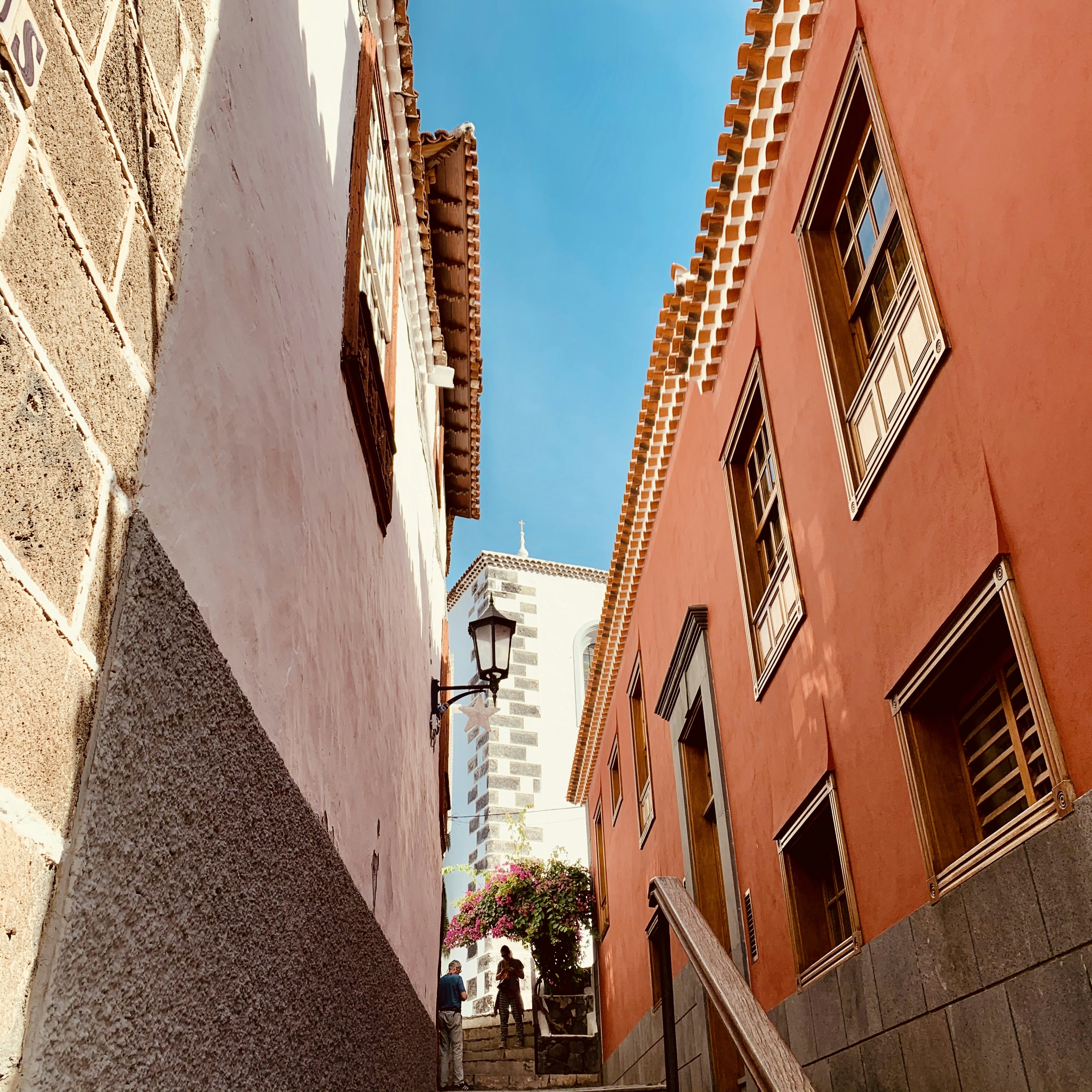 Terracotta Alley: Staircase to a Bright Blue Sky