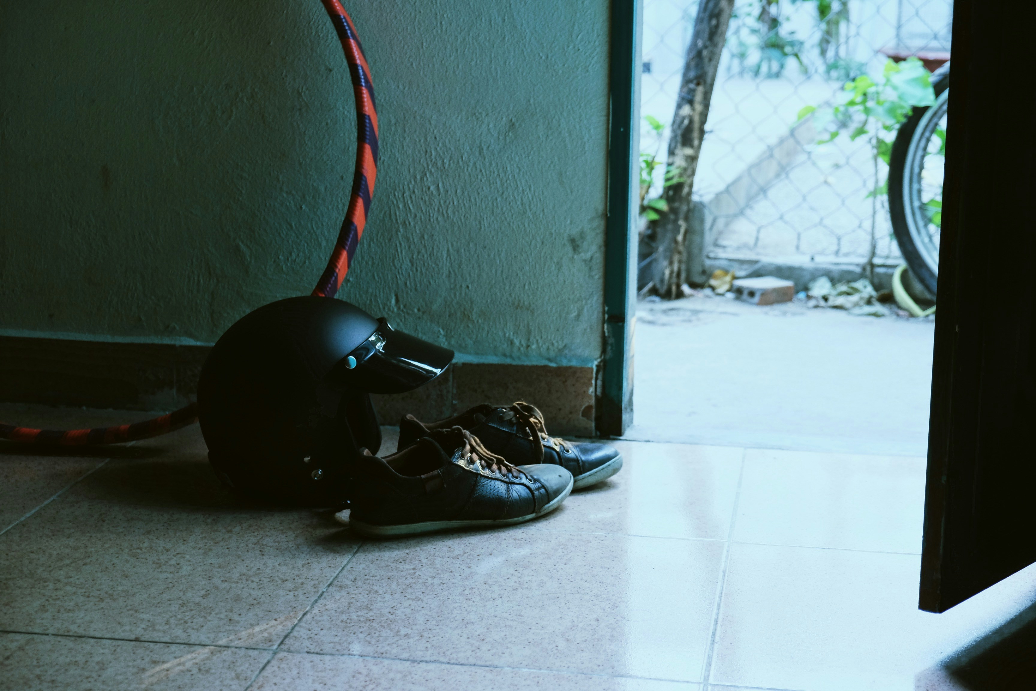 Shoes and Helmet at the Threshold