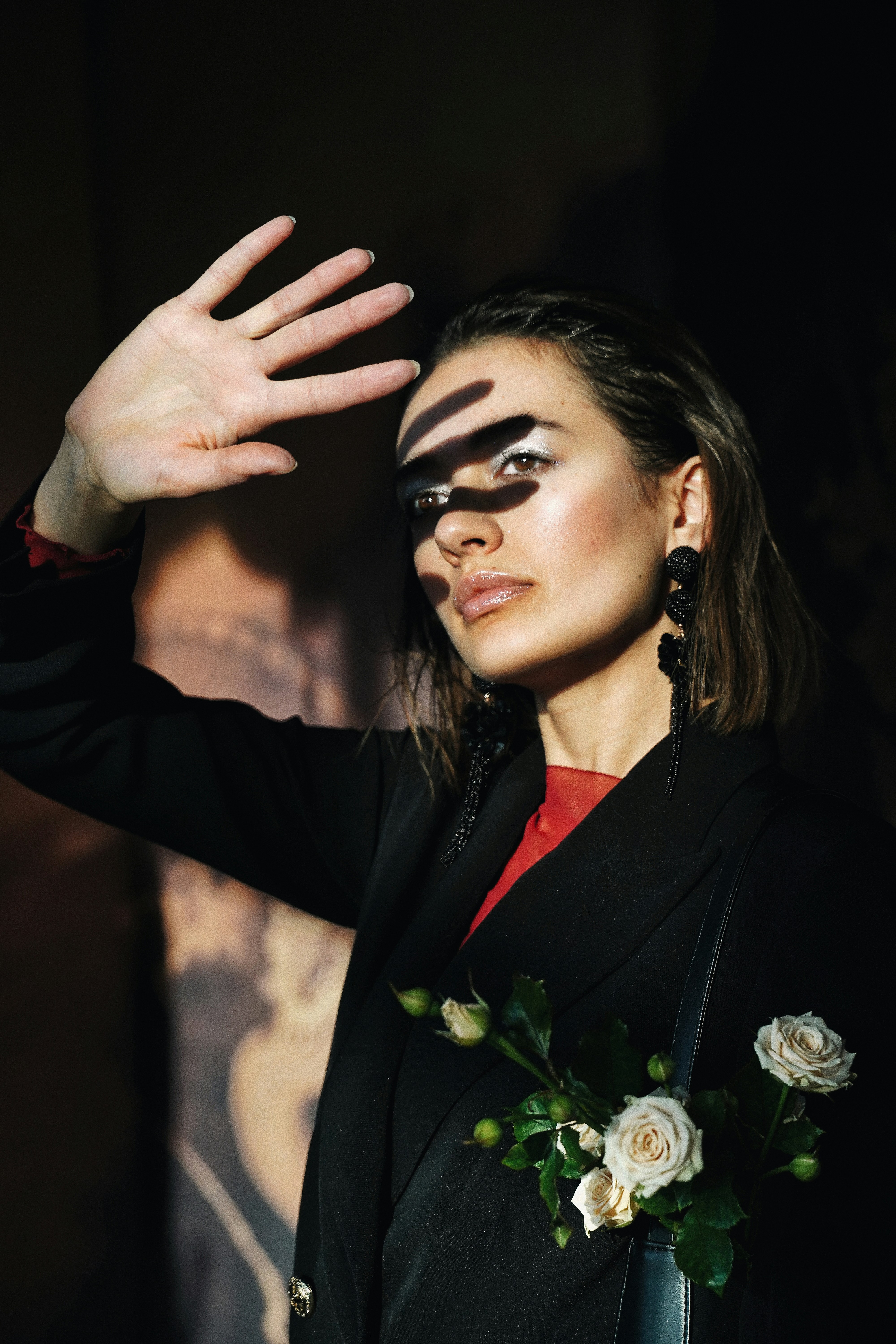 Shadow Play Portrait: A Hand Shield, Roses in Focus