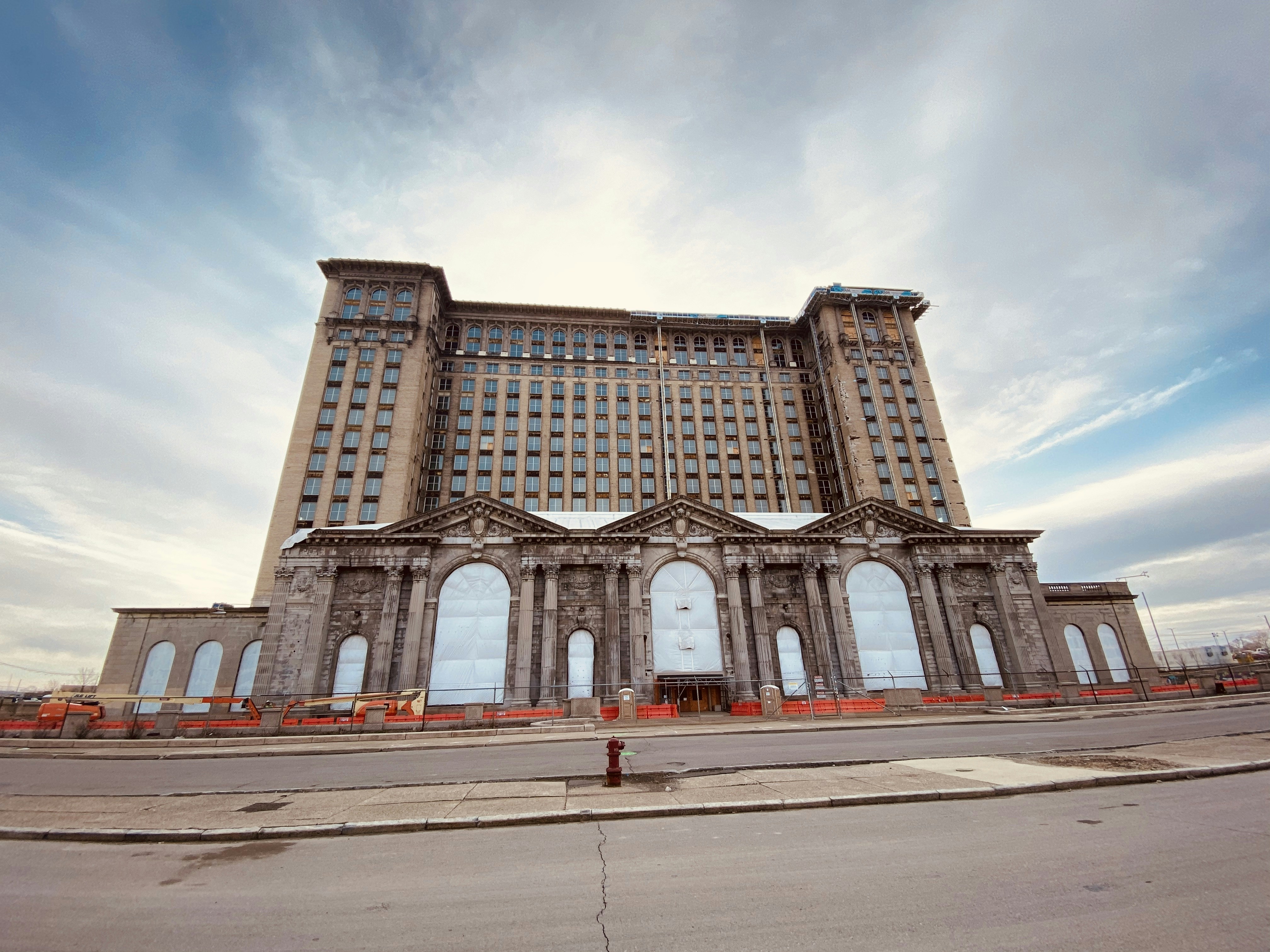 Historic building with ornate facade under a dramatic sky.