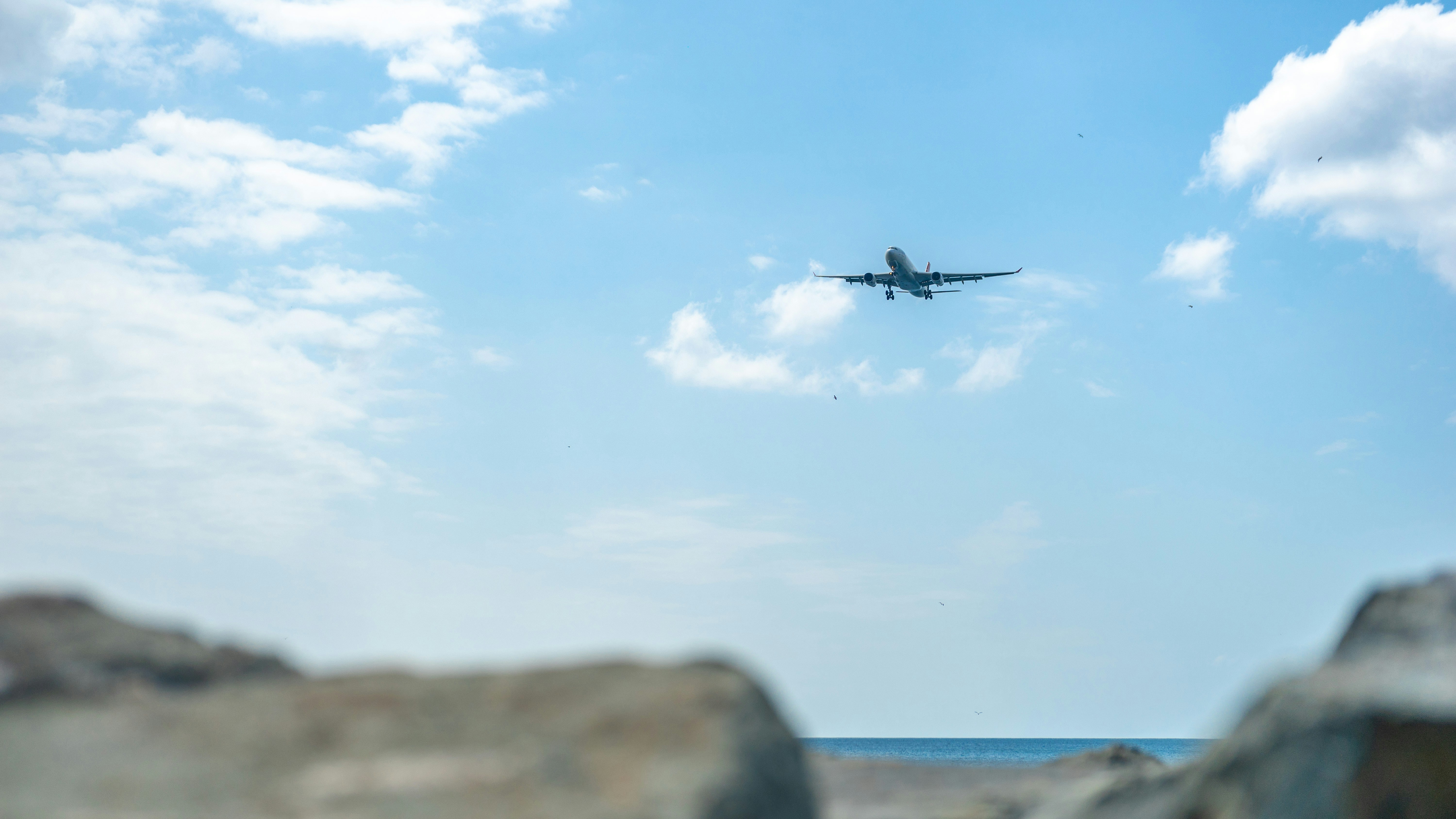 Airplane over water photo – Free Blue Image on Unsplash