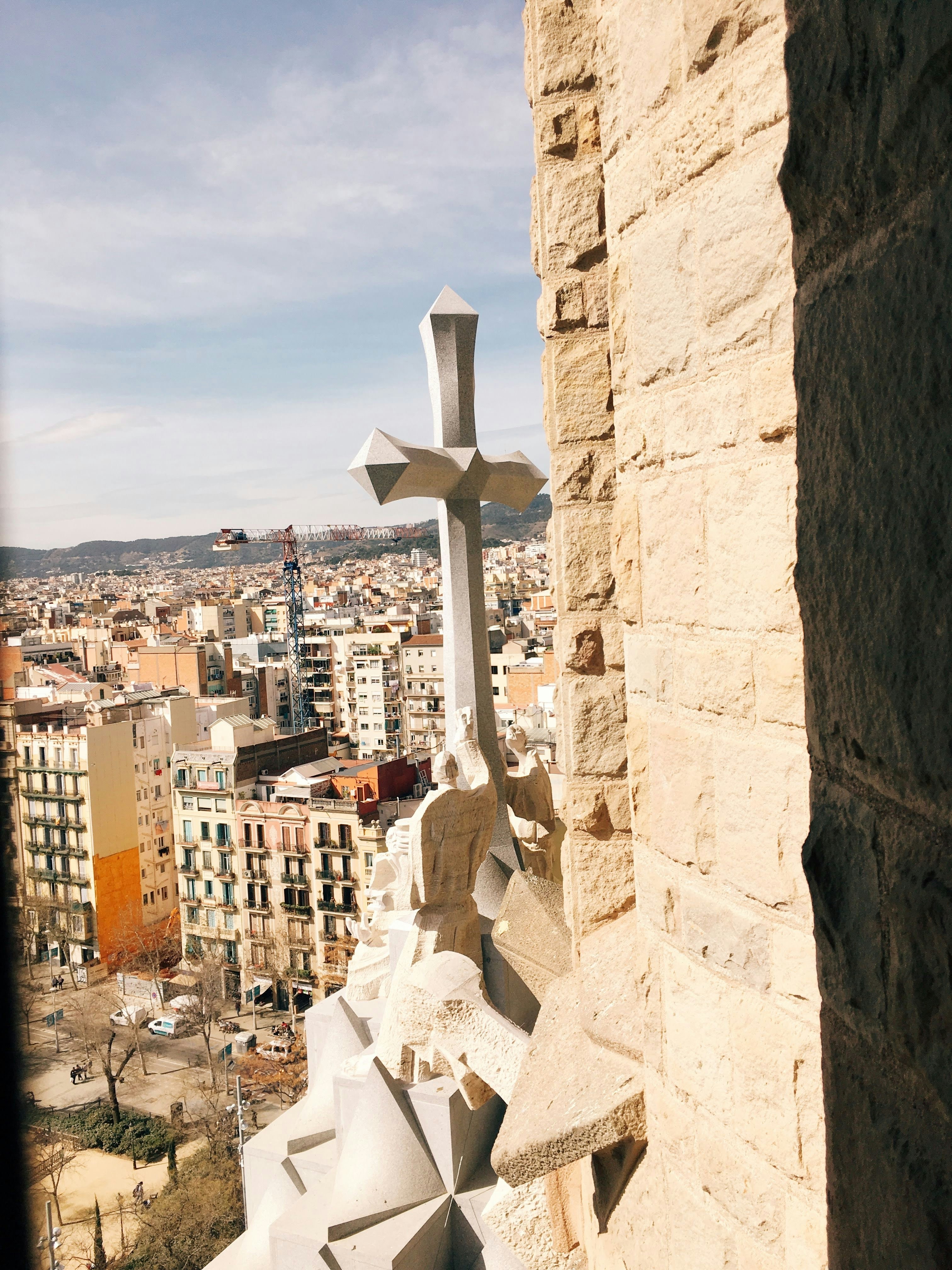 Stone Cross Over Barcelona: Rooftops and Dawn Light