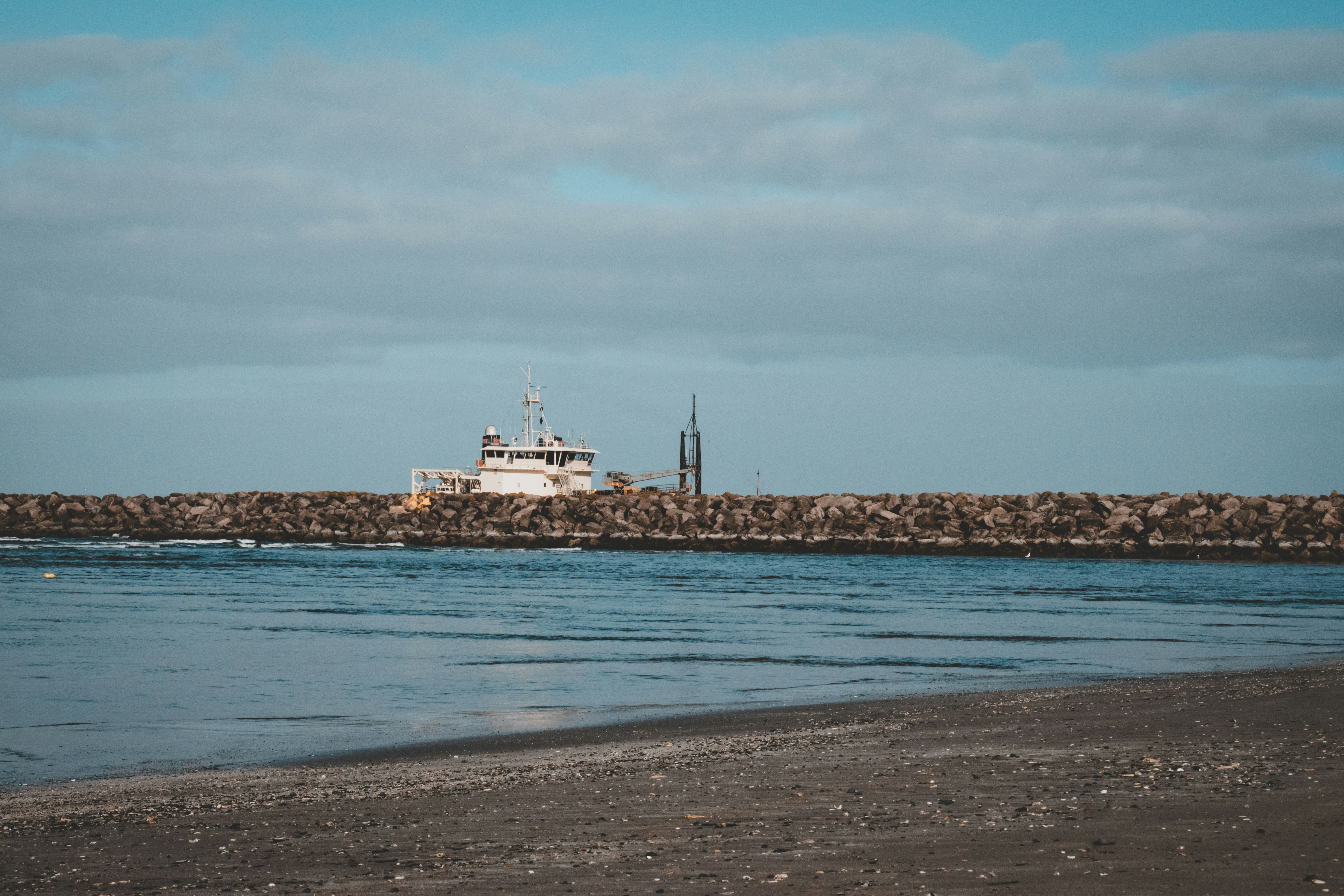 Harbor Vessel on a Quiet Breakwater