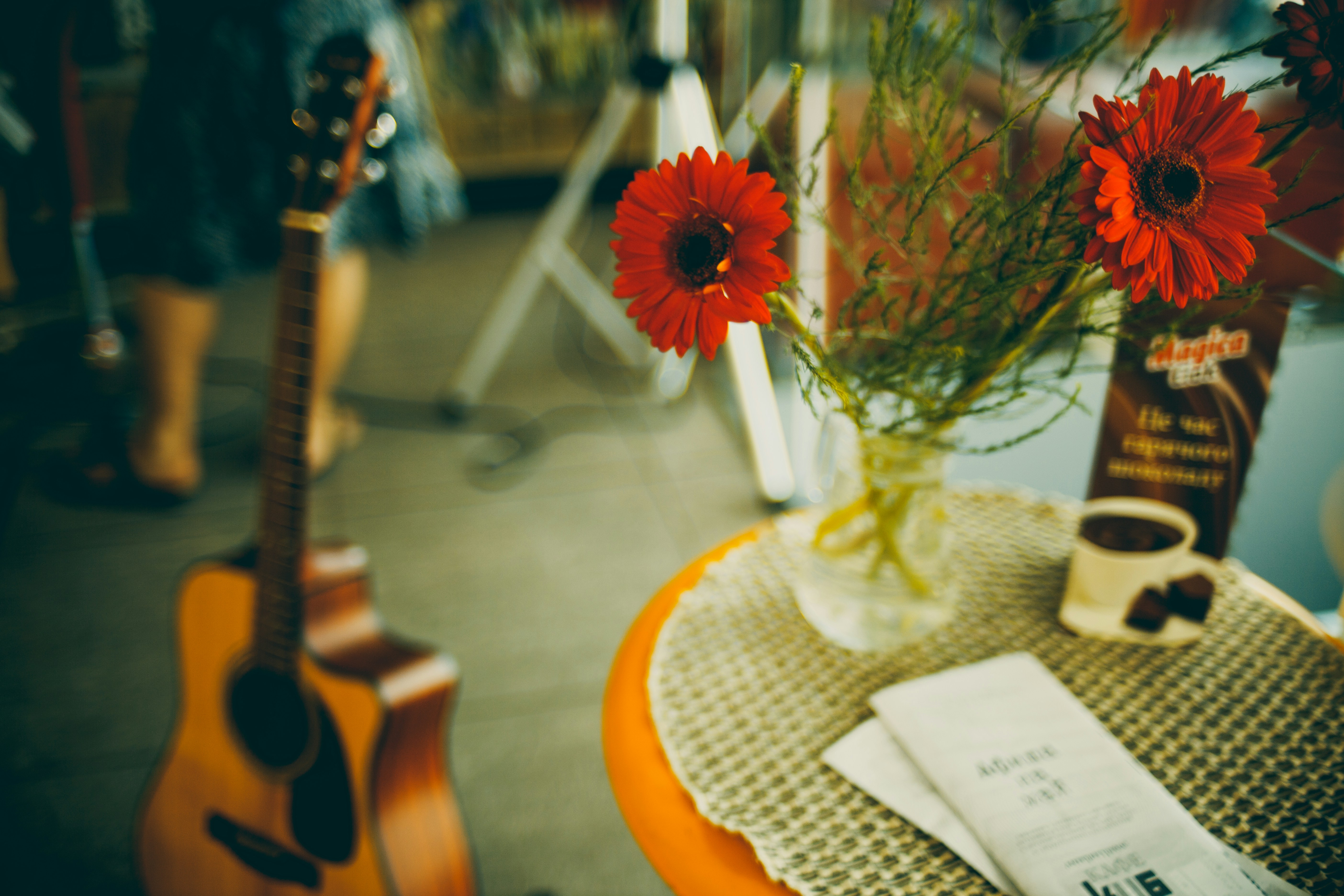 Vibrant Red Florals on a Rustic Café Table