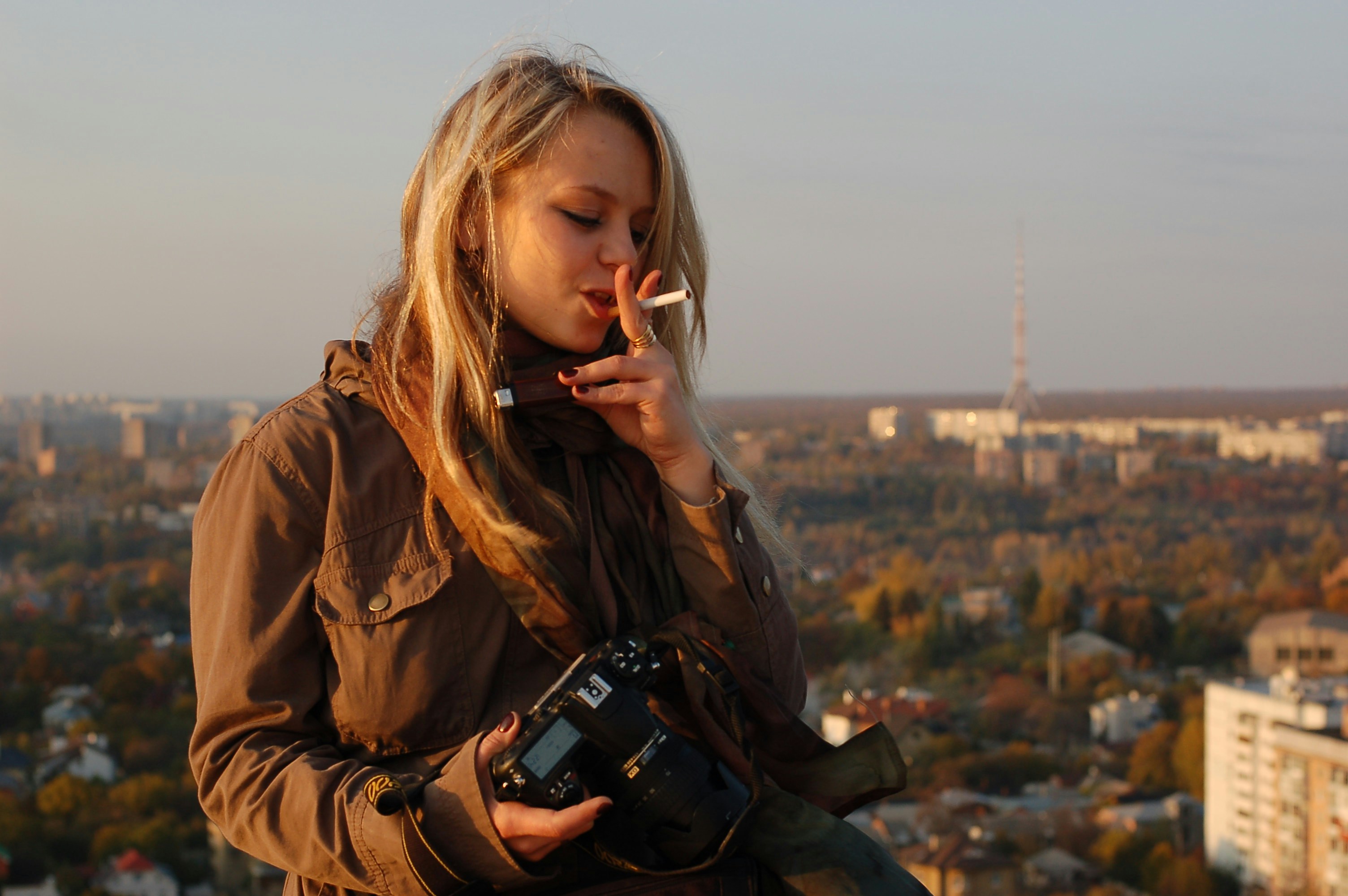 Selective focus photography of girl using cigarette during daytime ...