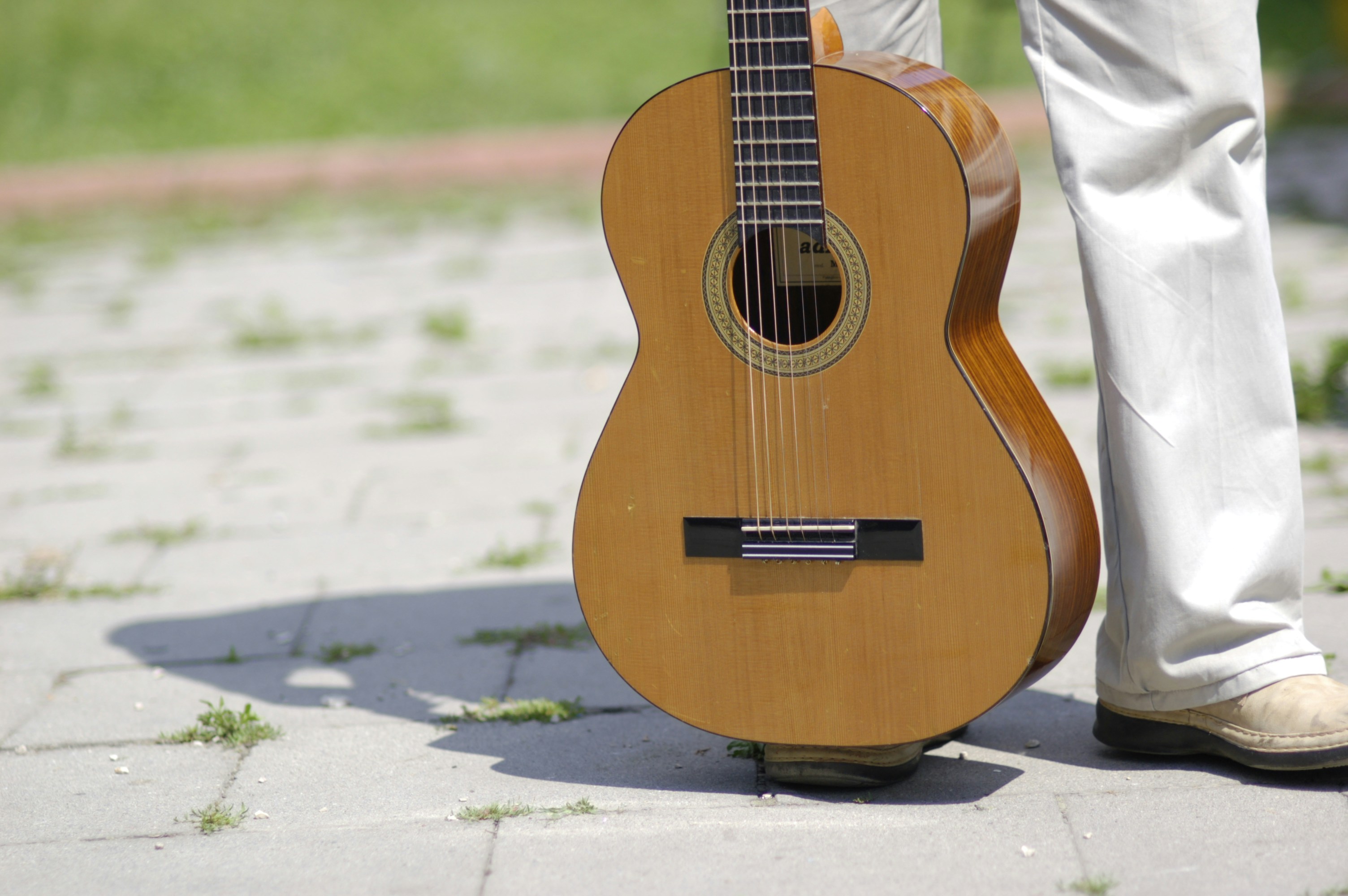 Sunlit Classical Guitar Basks on Quiet Pavement