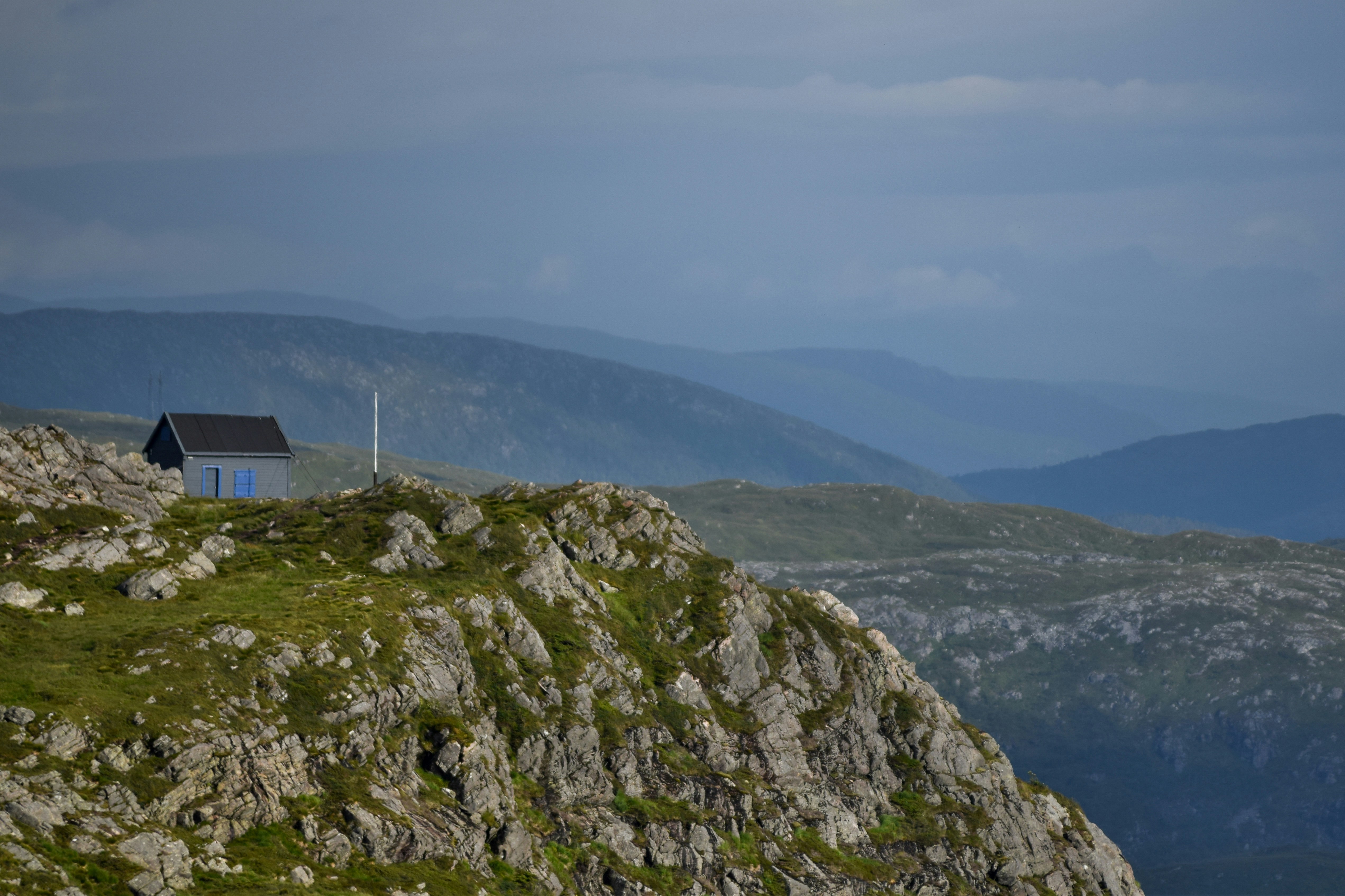 Cliffside Hut on a Windswept Ridge