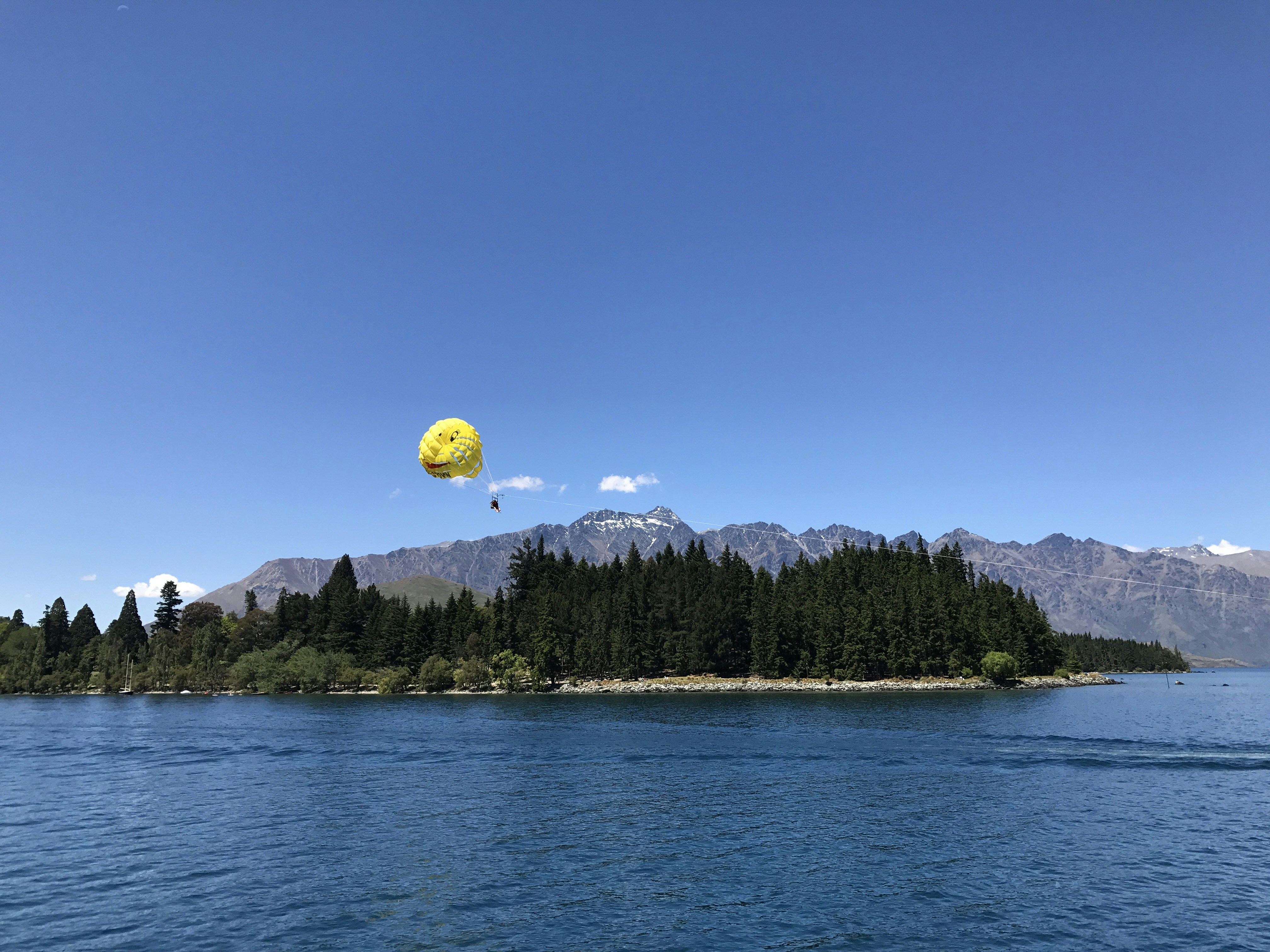 Sunny Parasail Adventure over Serene Lake