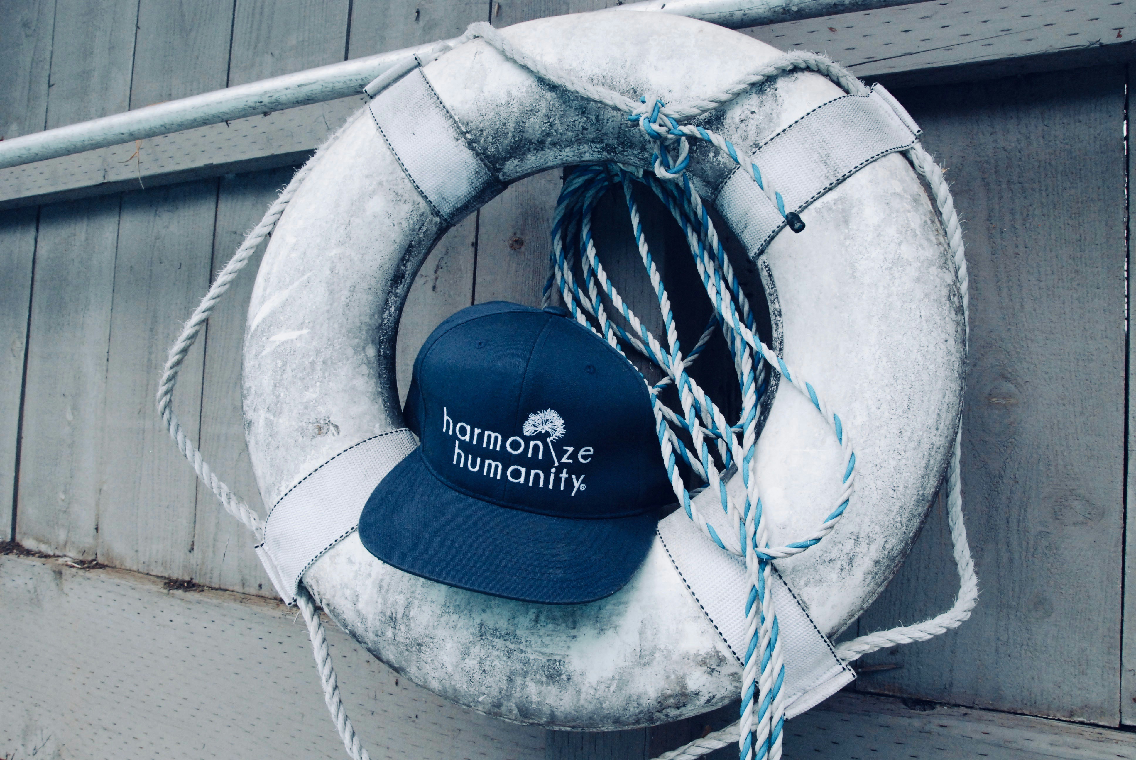 Lifebuoy and cap: a quiet beacon at the dock