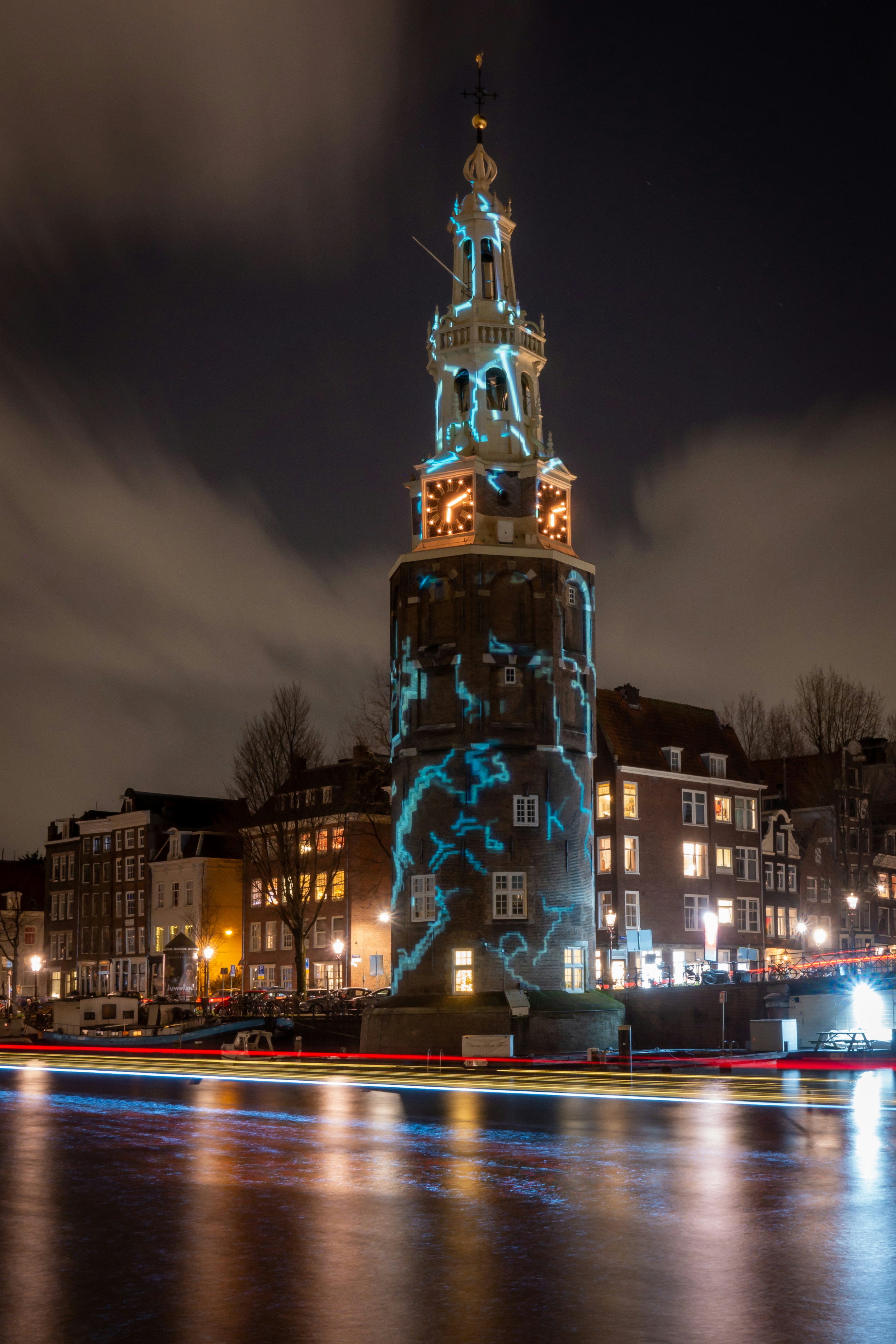Electric Veins Crown the Canal Tower at Night