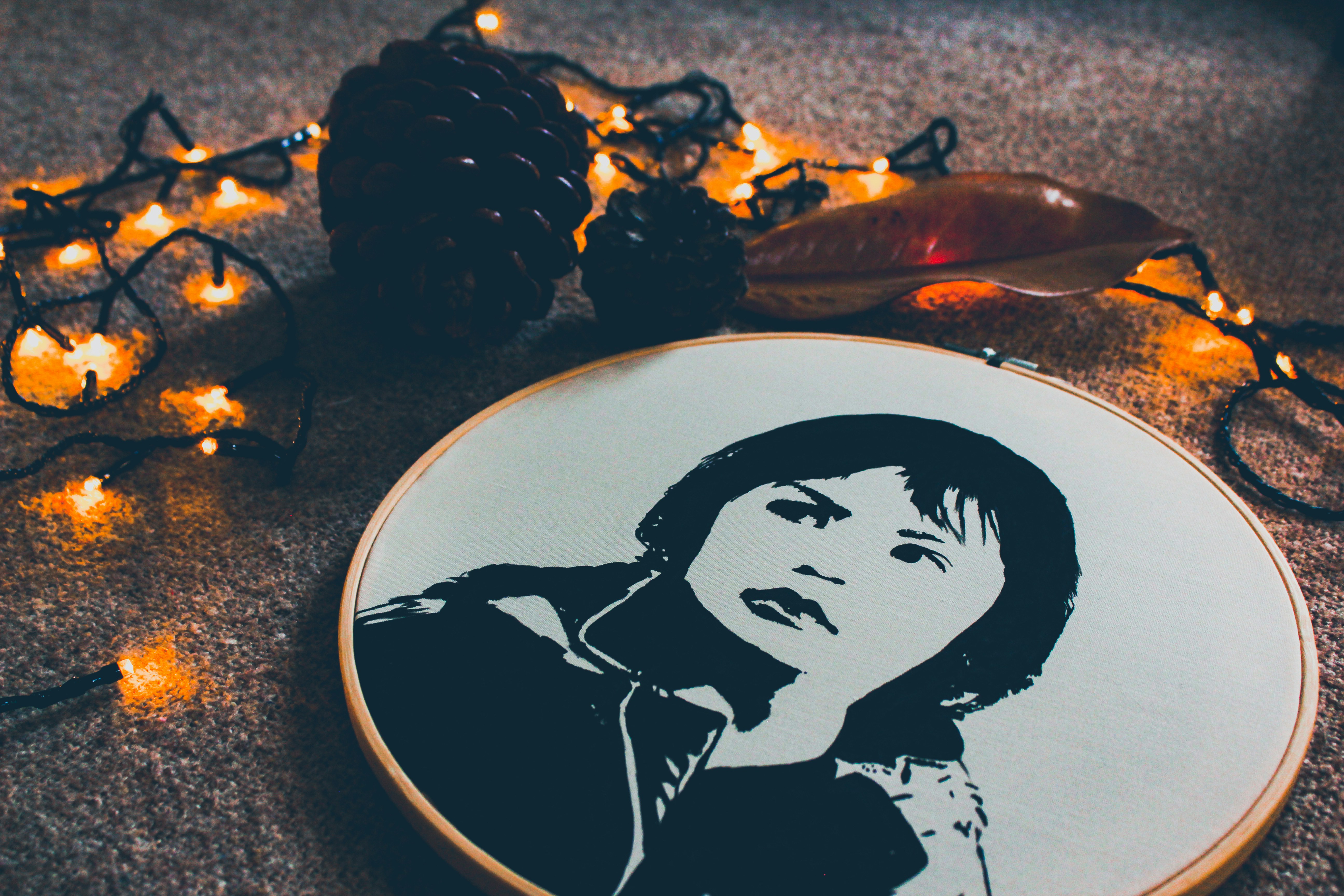 Embroidered Silhouette in a Hoop, Framed by Fairy Lights