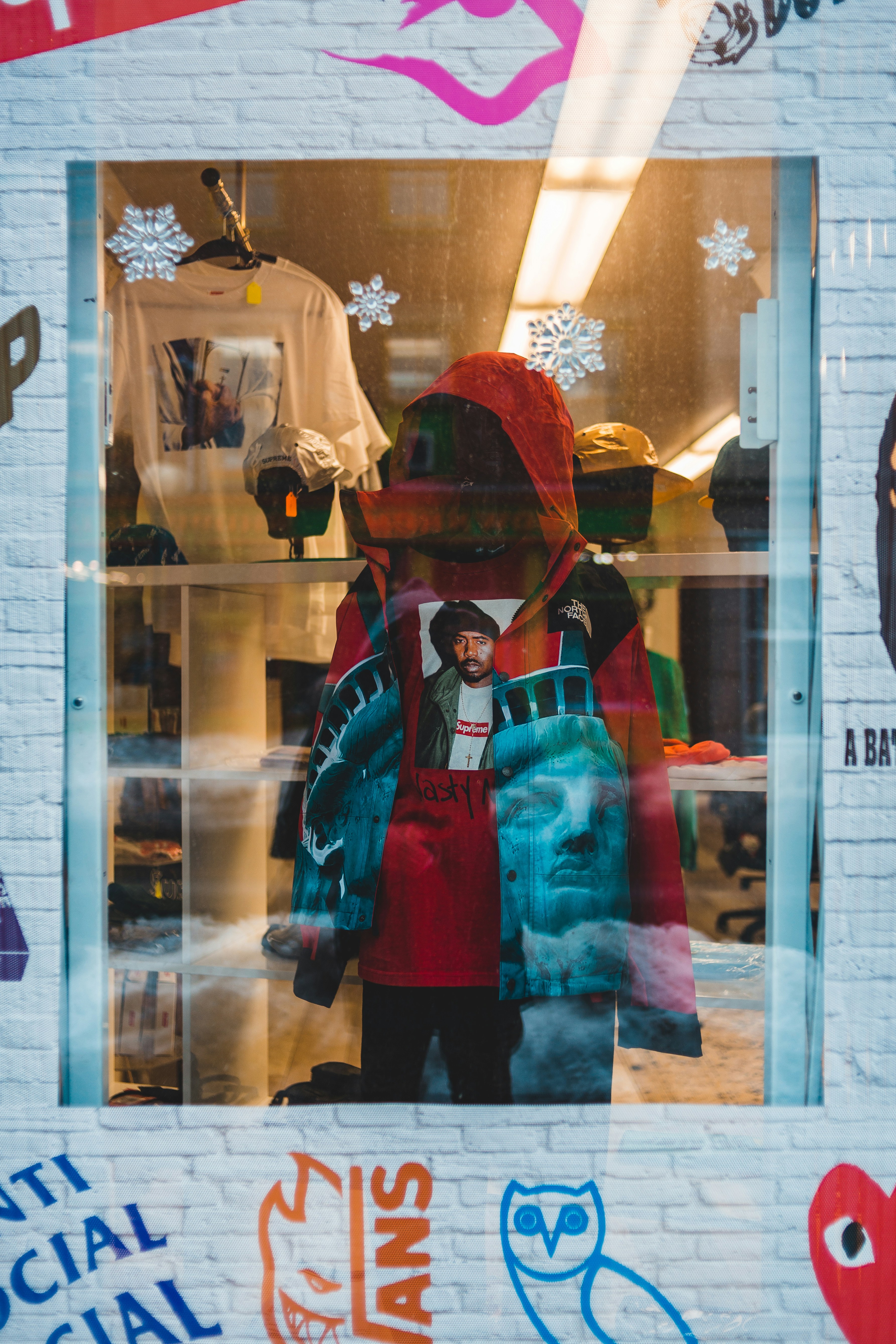 Red hoodie displayed inside shop by the window photo – Free Shop Image ...
