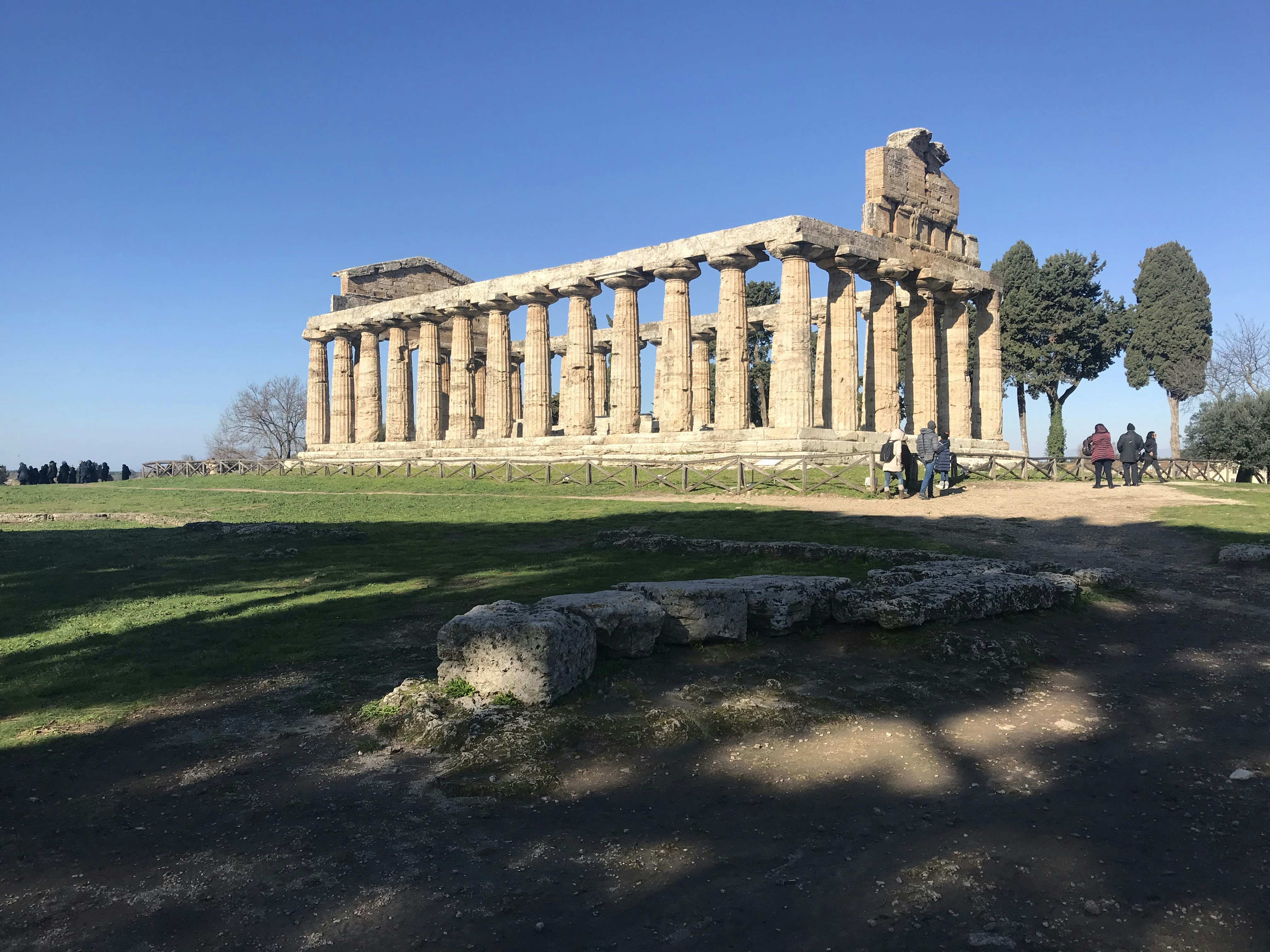 I templi di Paestum | people standing beside temple ruins