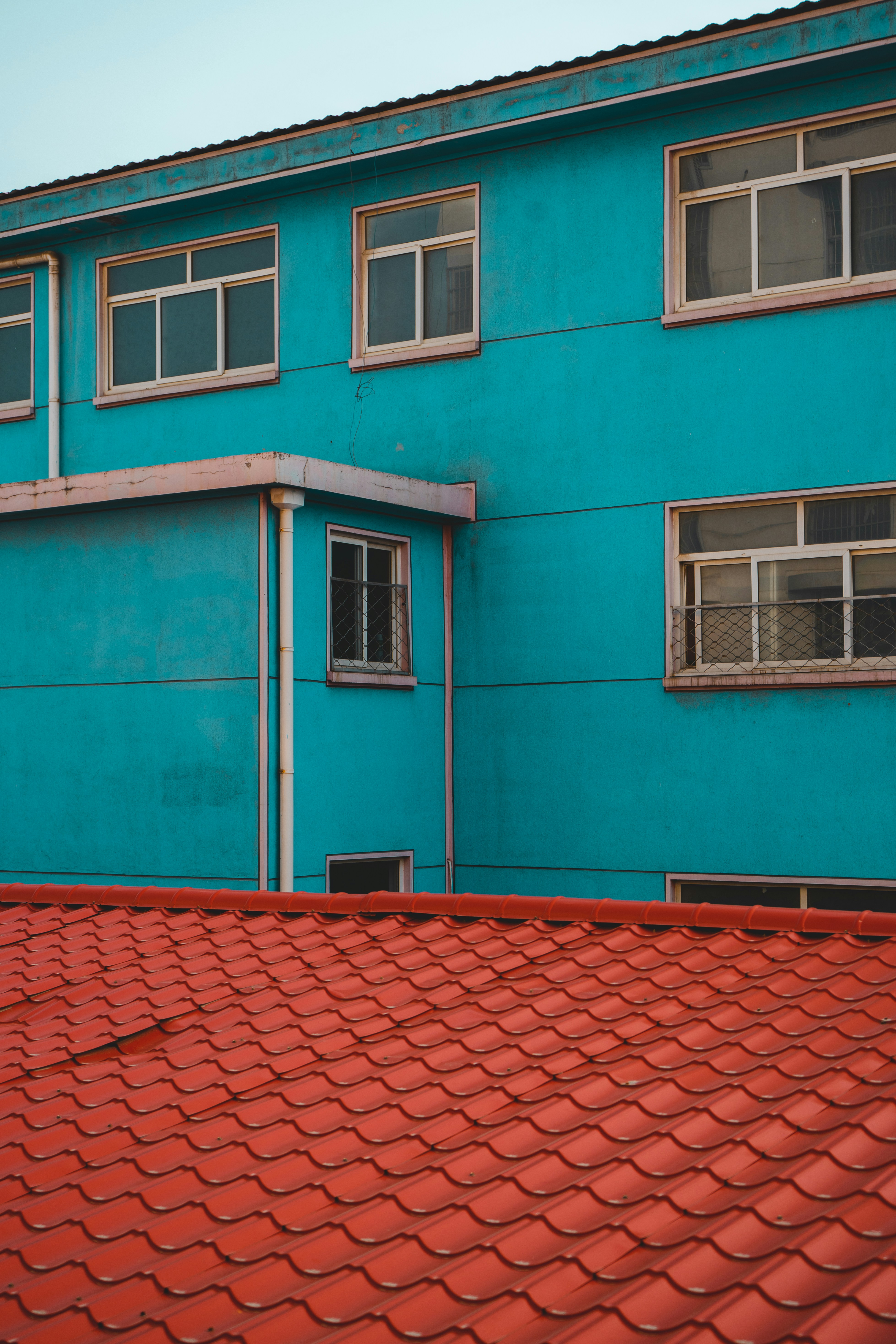 Selective focus photography of blue concrete building during daytime ...