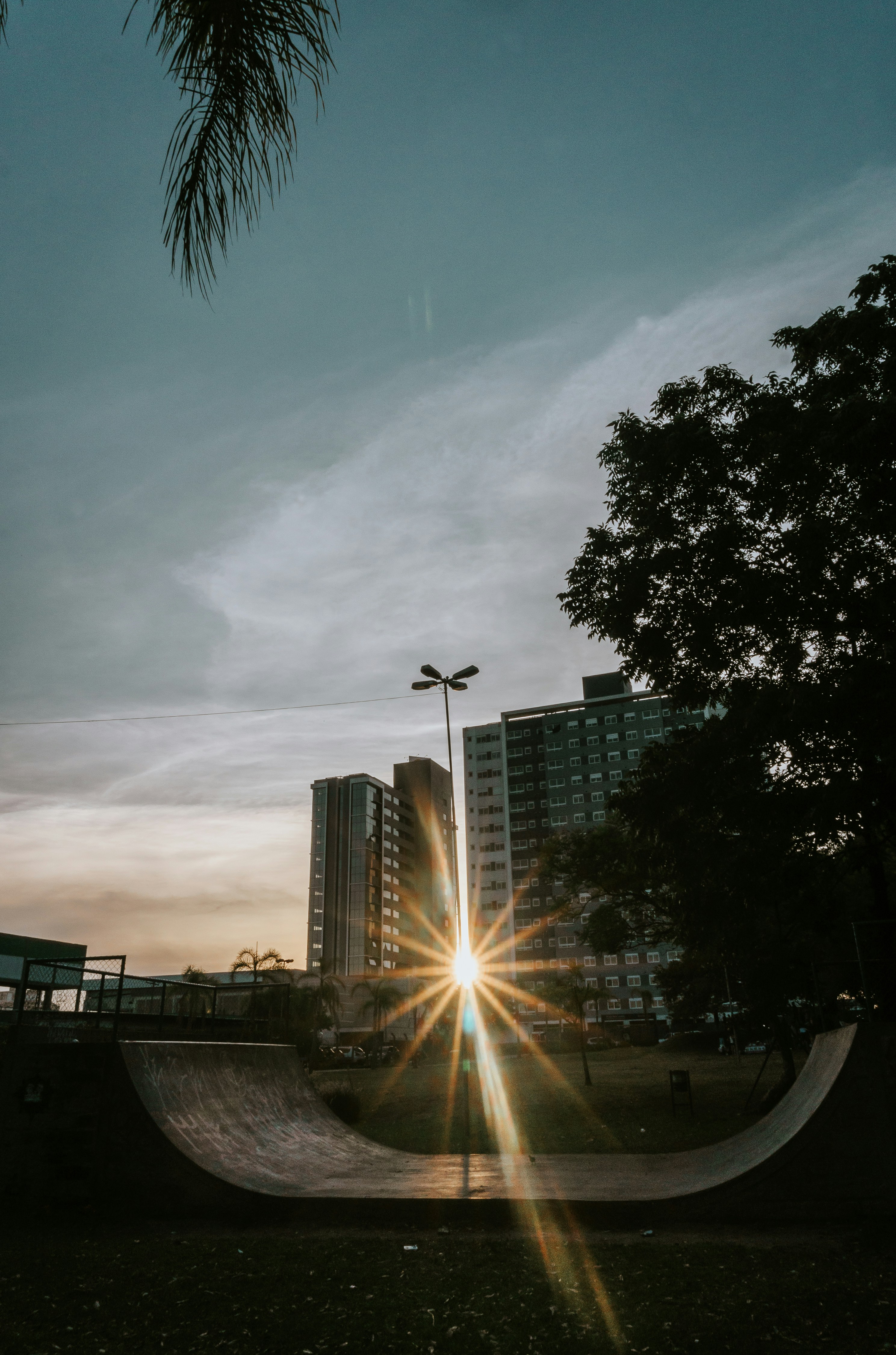 Dusk Sunburst Over the City Skate Bowl