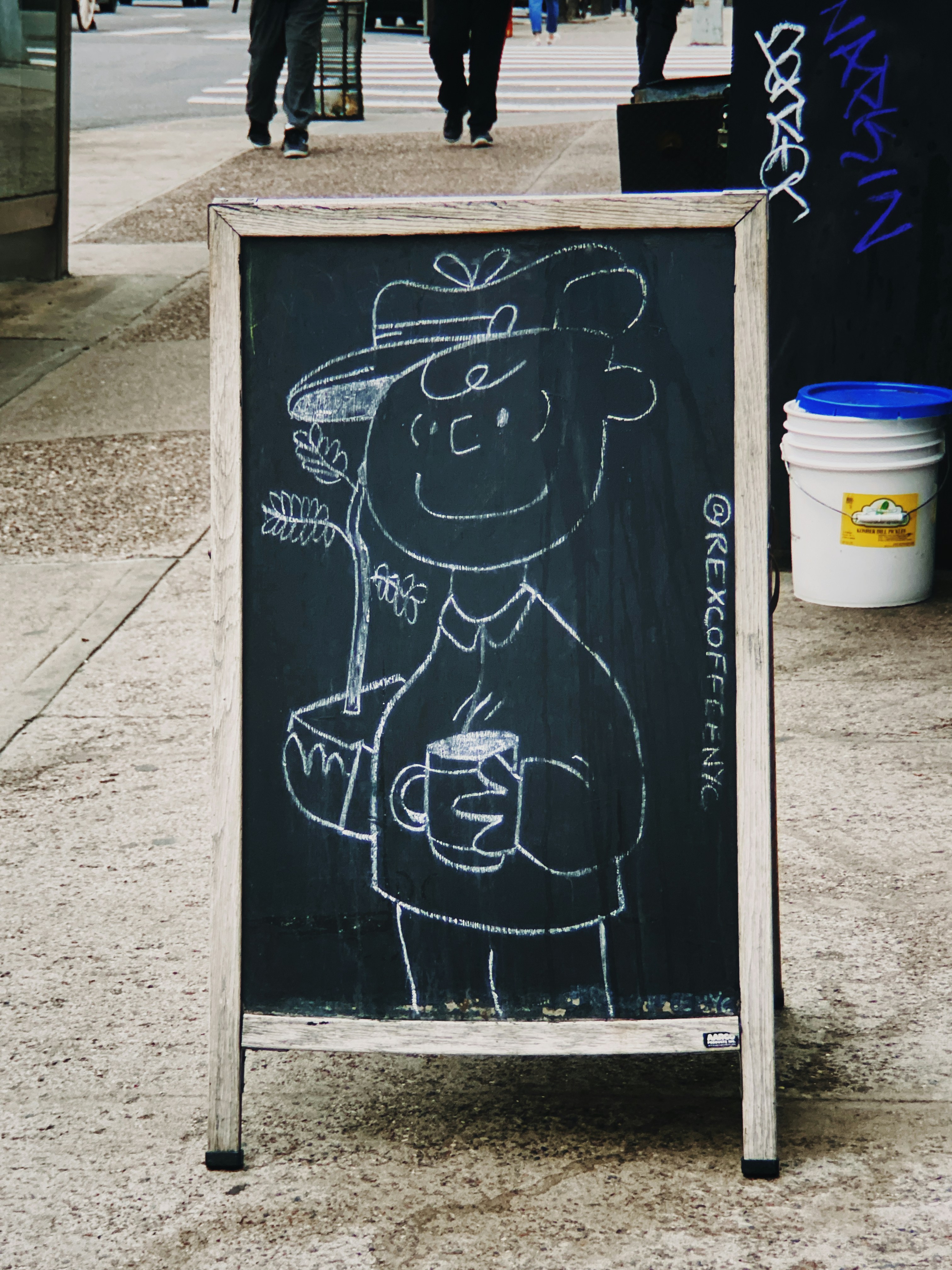 Chalkboard Character: A Friendly Street Scene in Chalk on Wood