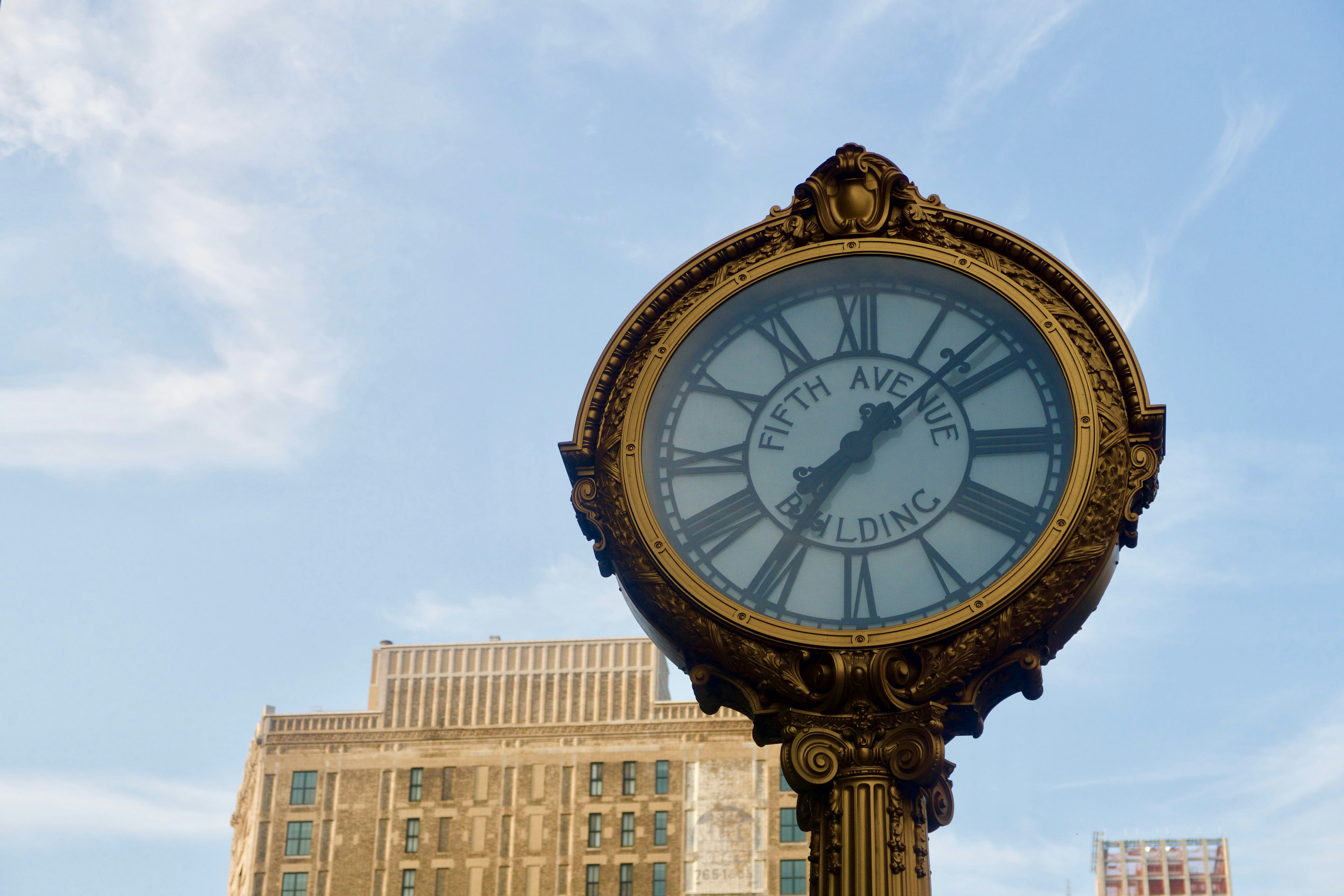 Brown Fifth Avenue Building clock during daytime photo – Free Building ...