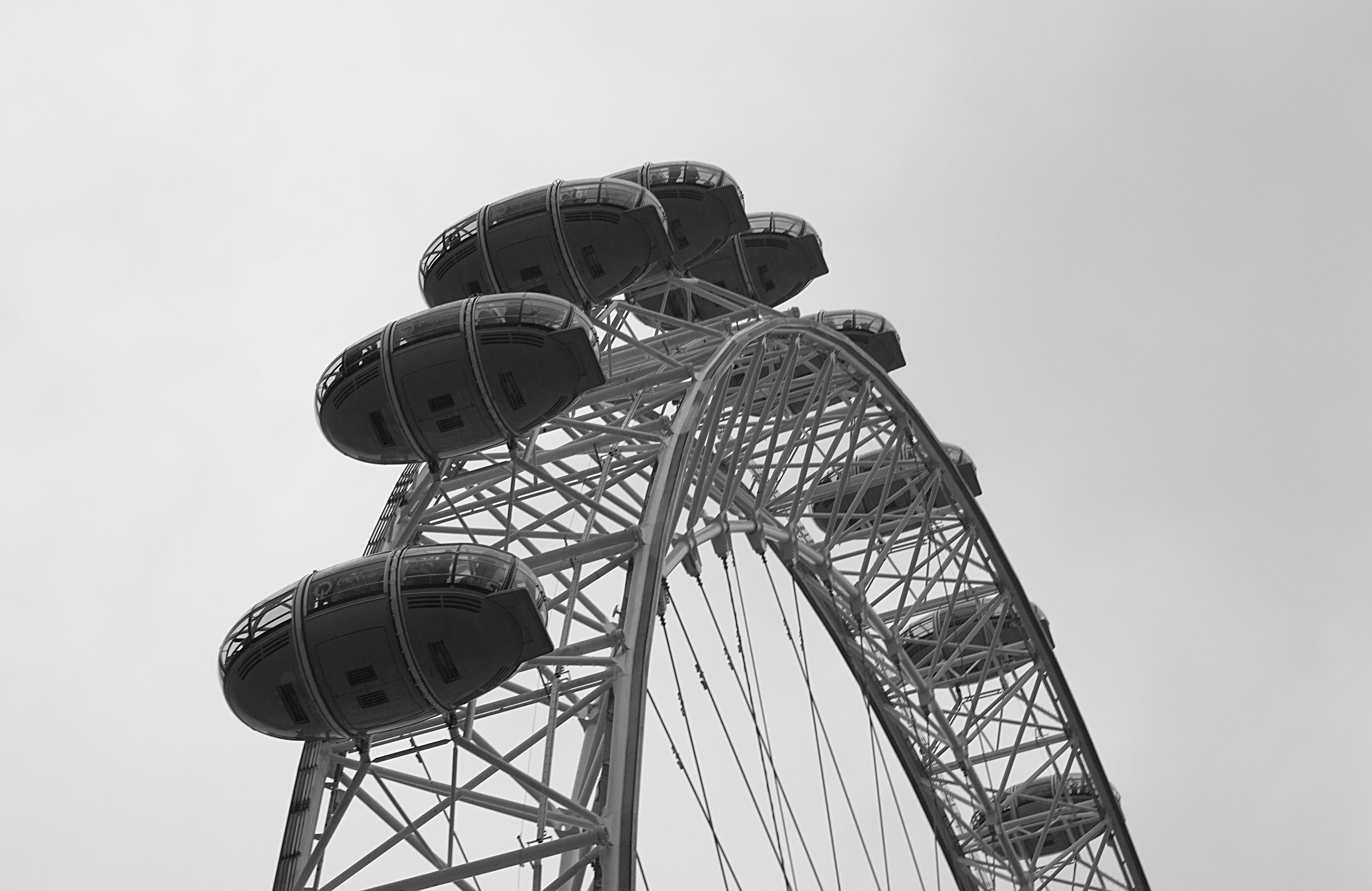 Under the Arc of Steel: Monochrome Ferris Wheel Reaches Toward the Sky