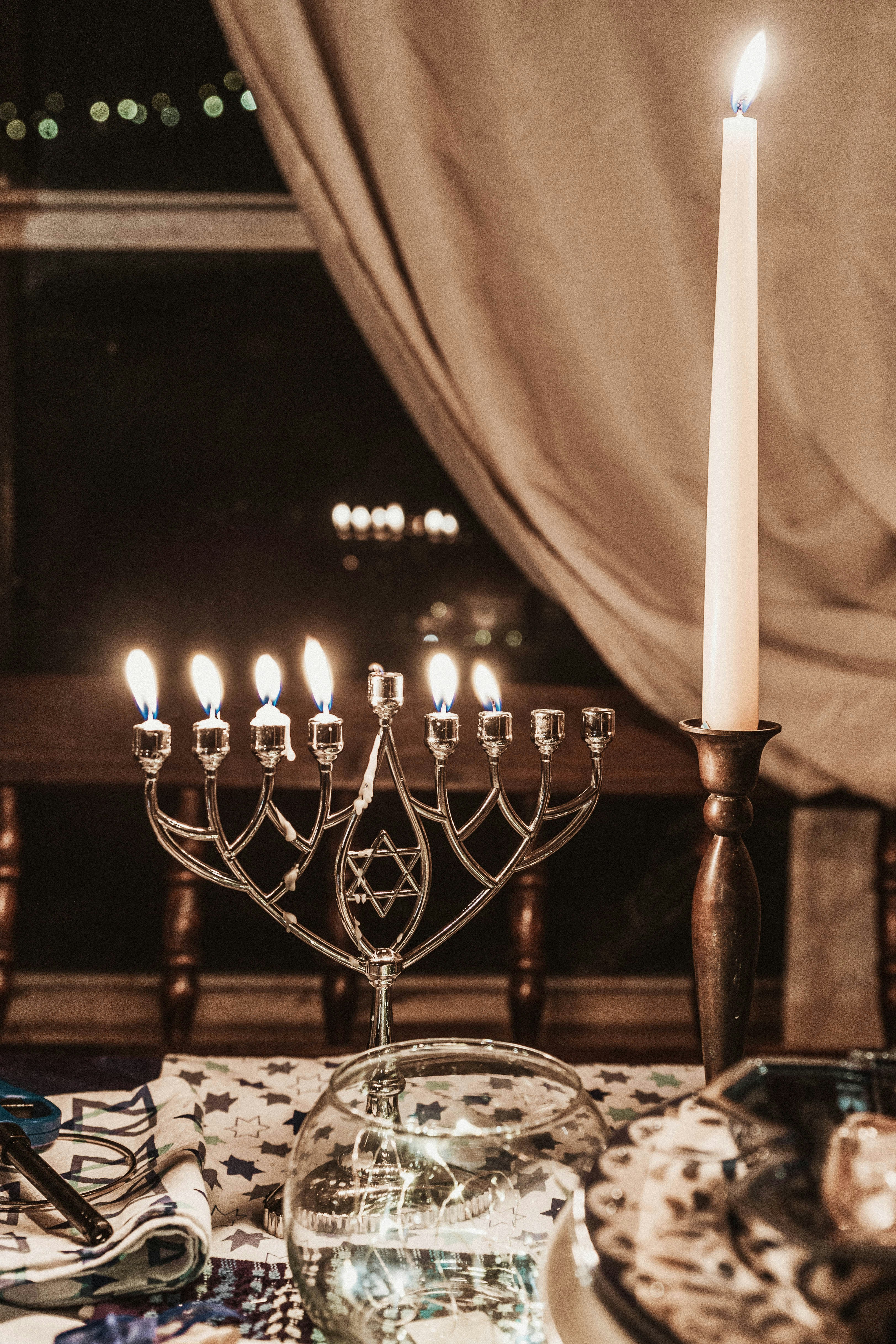 Candlelit Menorah Tableau by a Starry Tablecloth