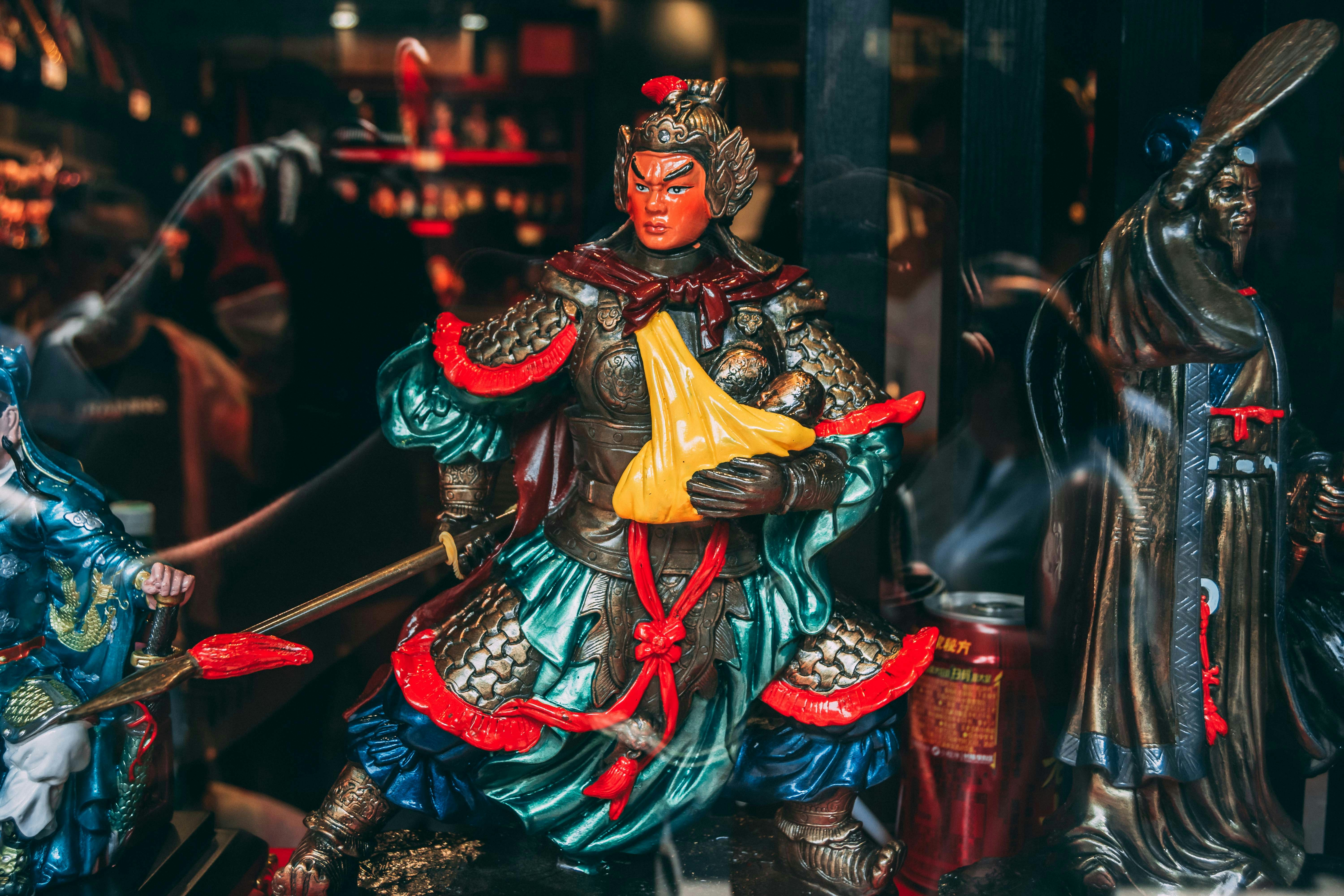 Ornate Chinese warrior statuette with vivid colors and intricate armor details.