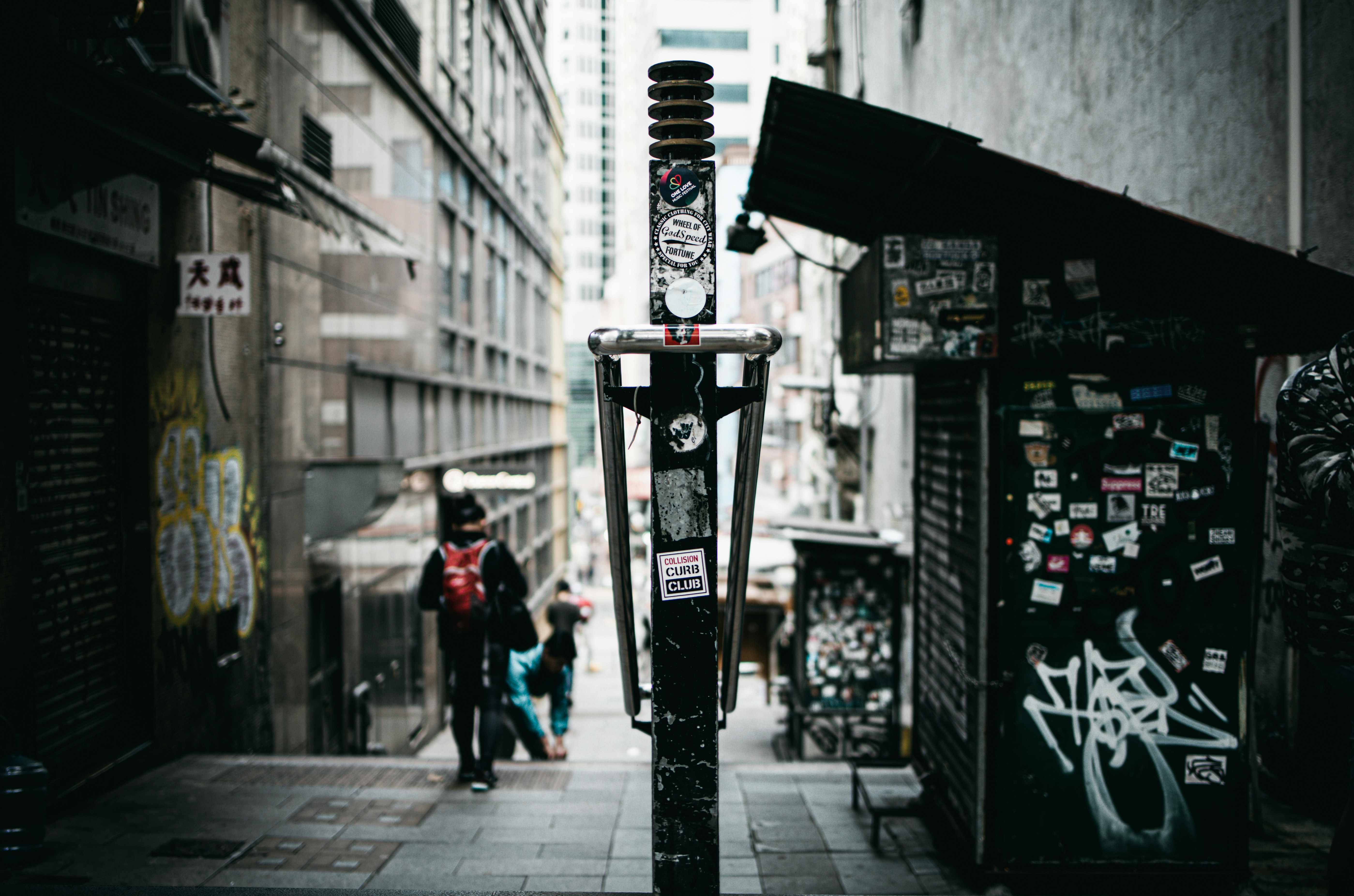 Stickered Sentinel in a Narrow Alley