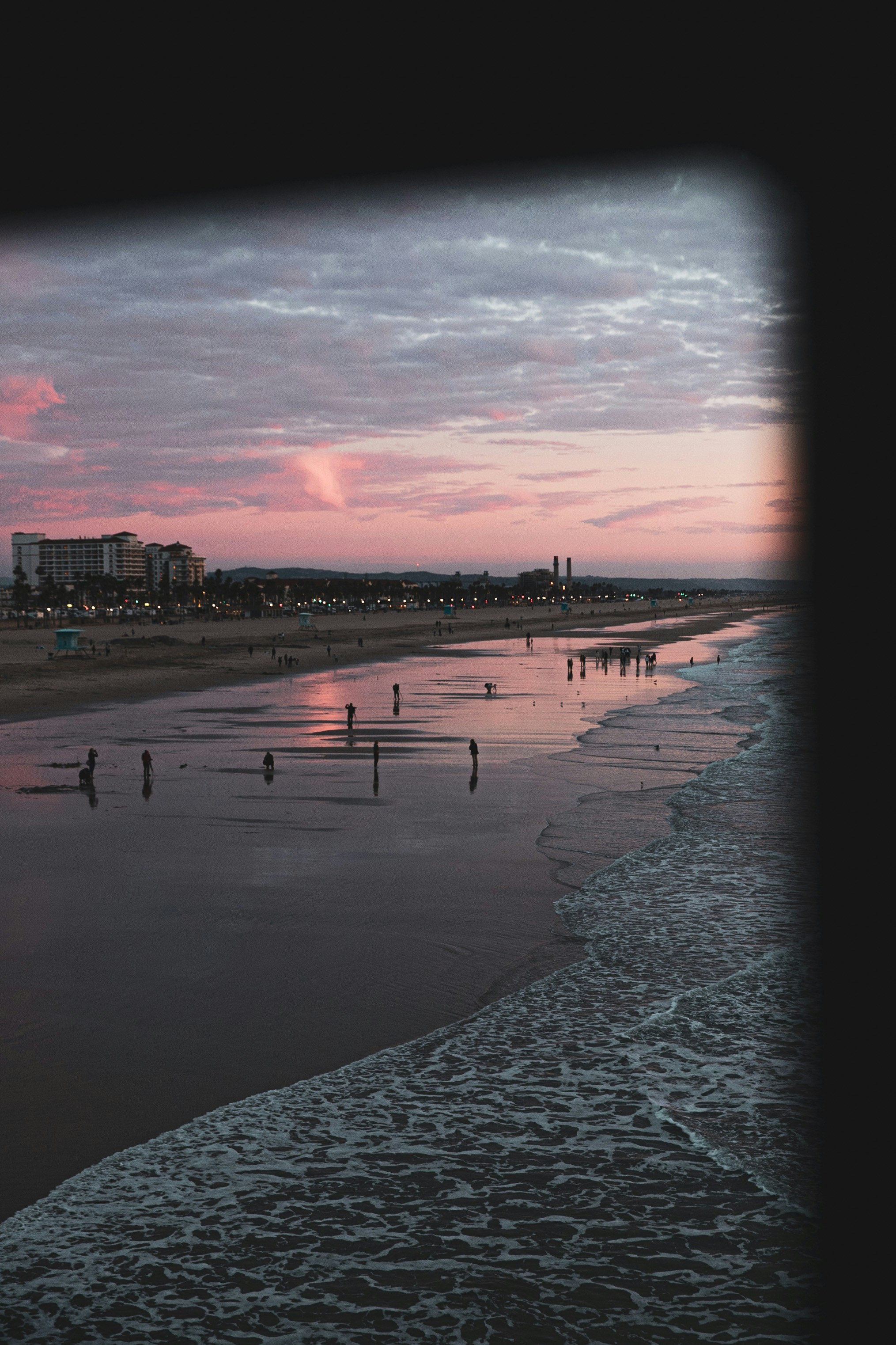Pink Horizon over Quiet Tides: Evening Beach Silhouette