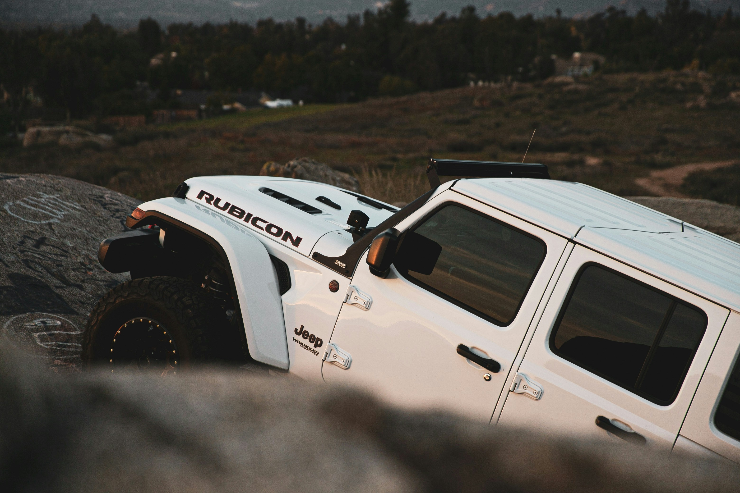 Granite Grit: Jeep Rubicon conquers a jagged hillside under autumn light