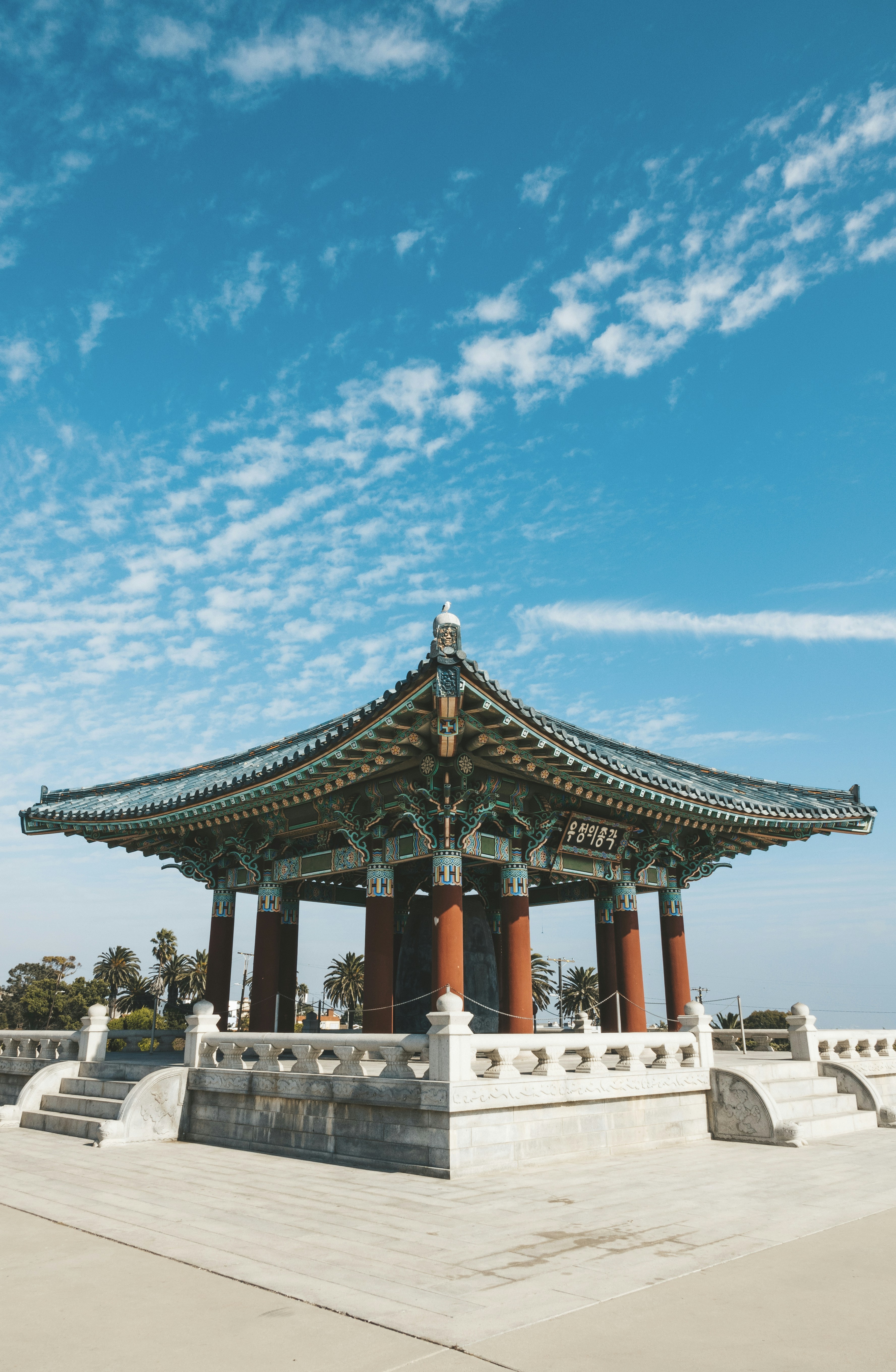 Azure Canopy Over an Ornate Chinese Pavilion on White Stone Terraces