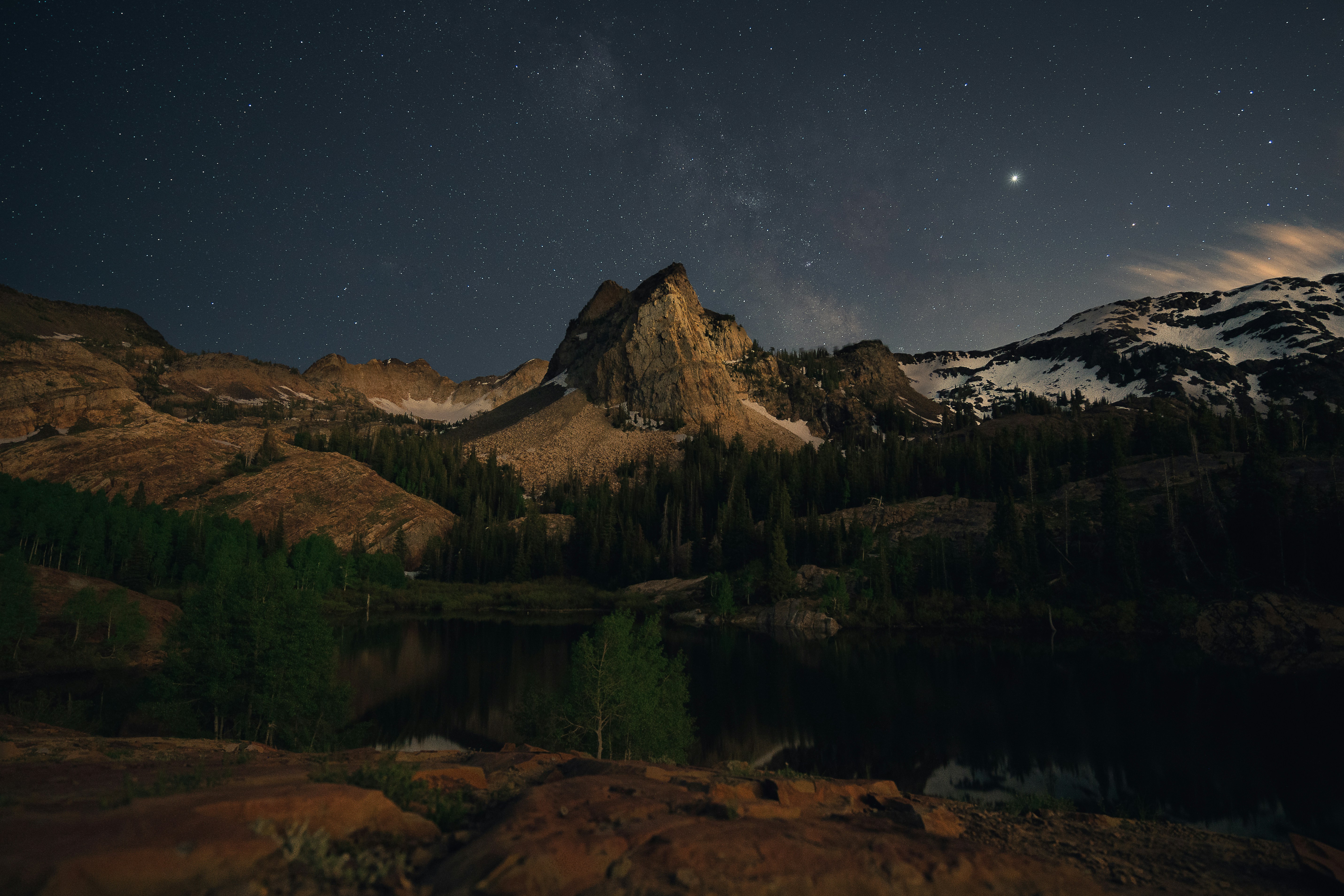 Moonlit Pinnacle Over a Quiet Alpine Lake at Night