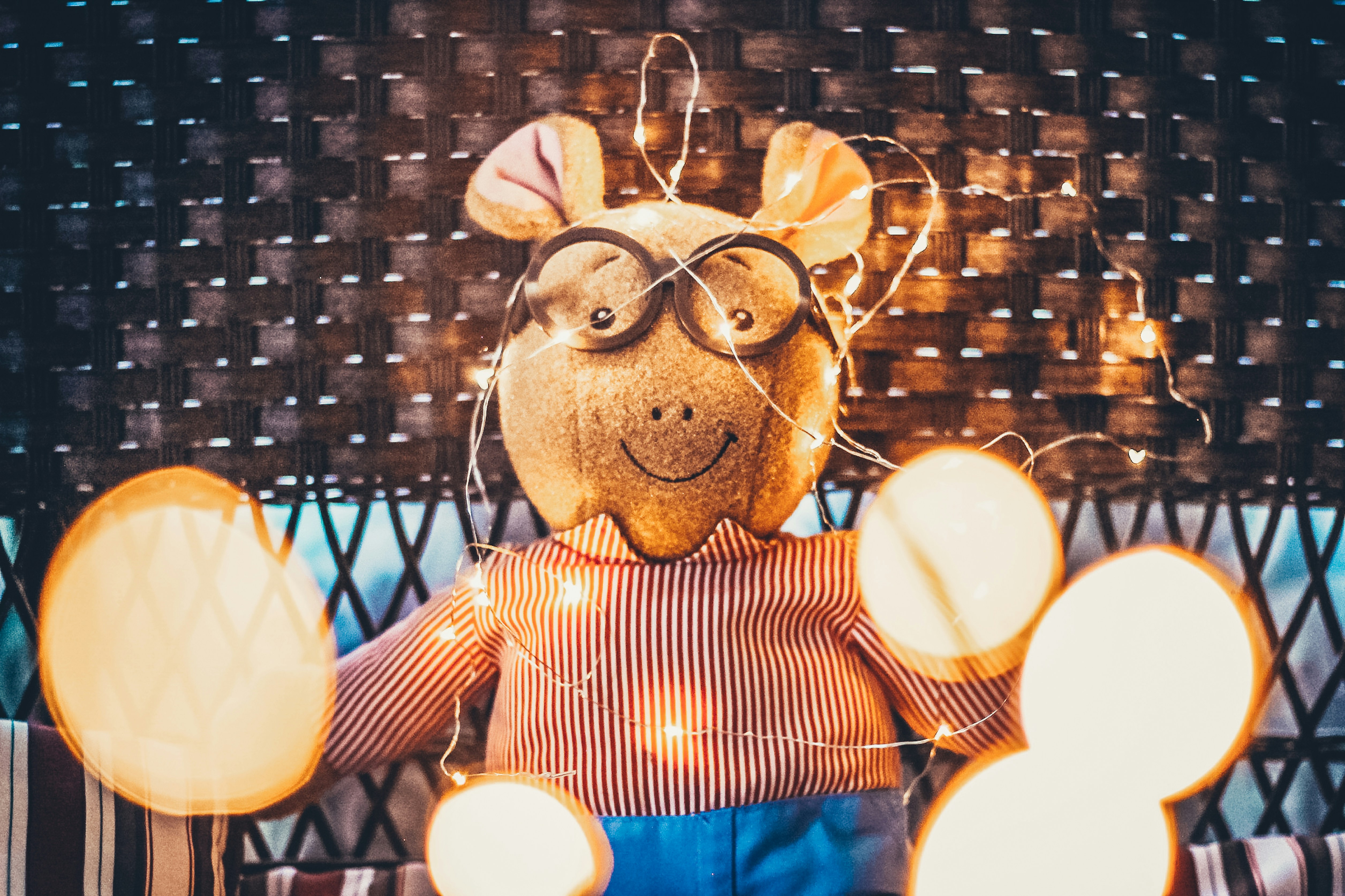 Glowing Toyhood: A Plush Friend Amid Fairy Lights