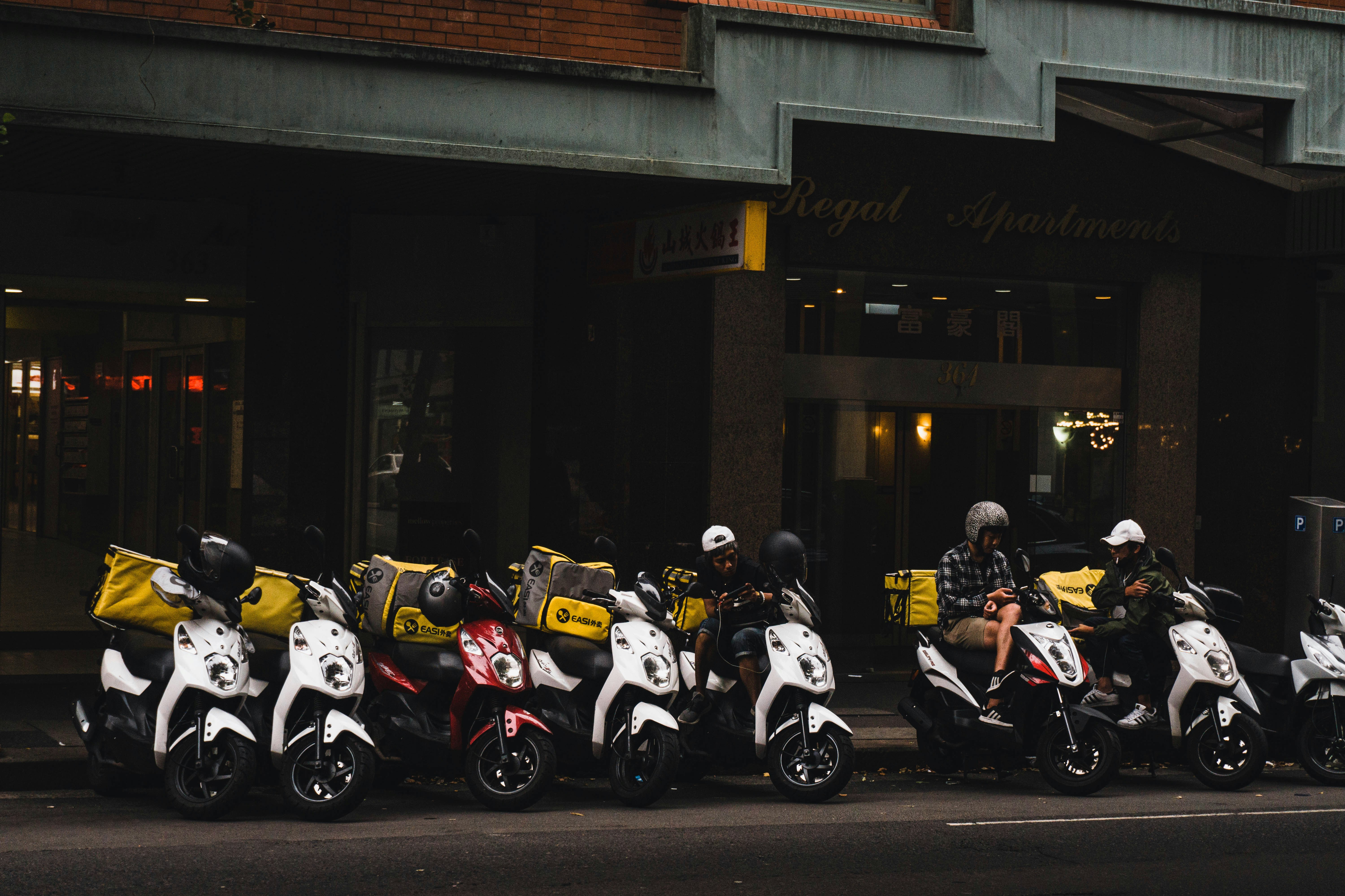 White and black sports bike parked beside brown building photo – Free ...