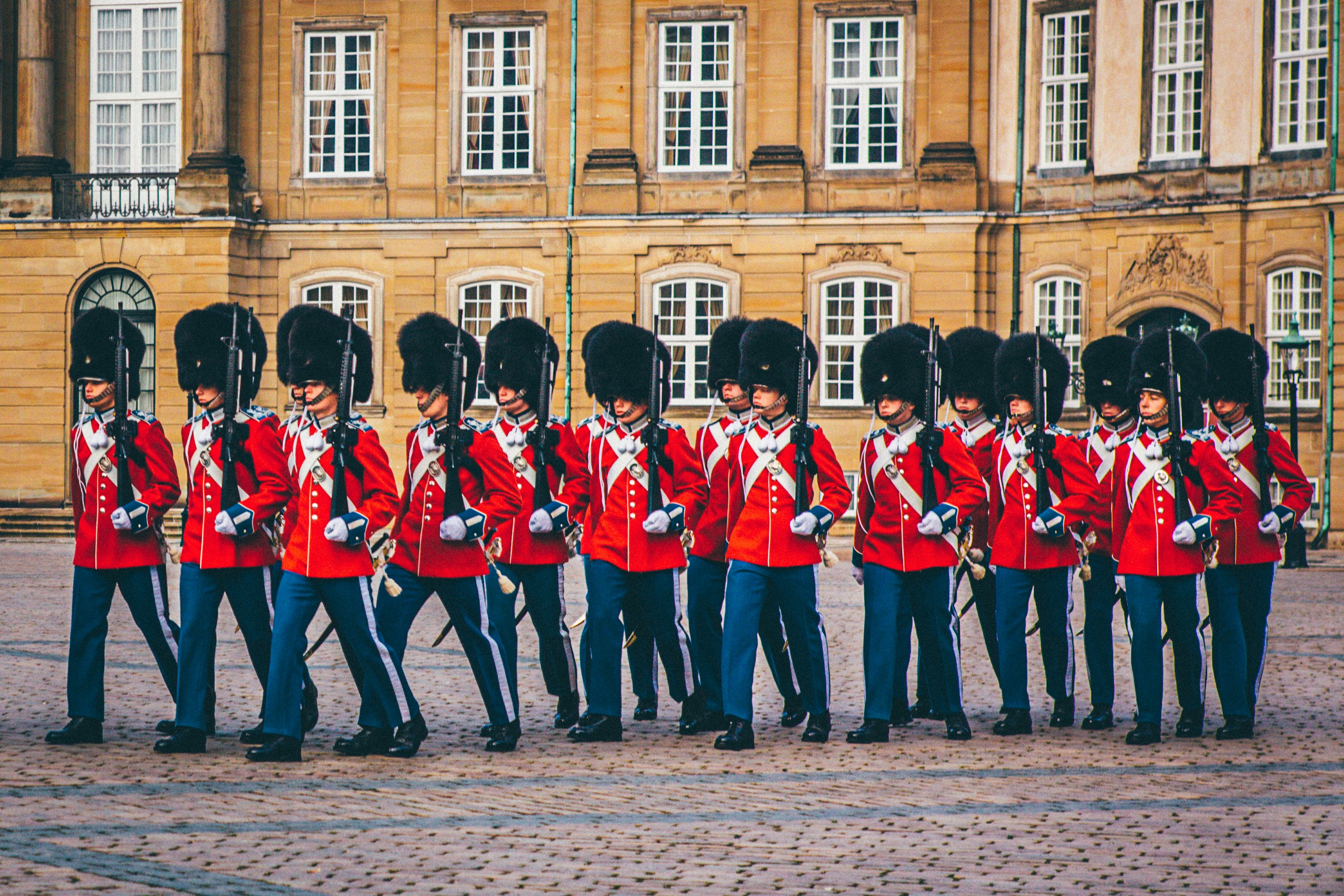 Group of man marching on the pavement photo – Free Human Image on Unsplash