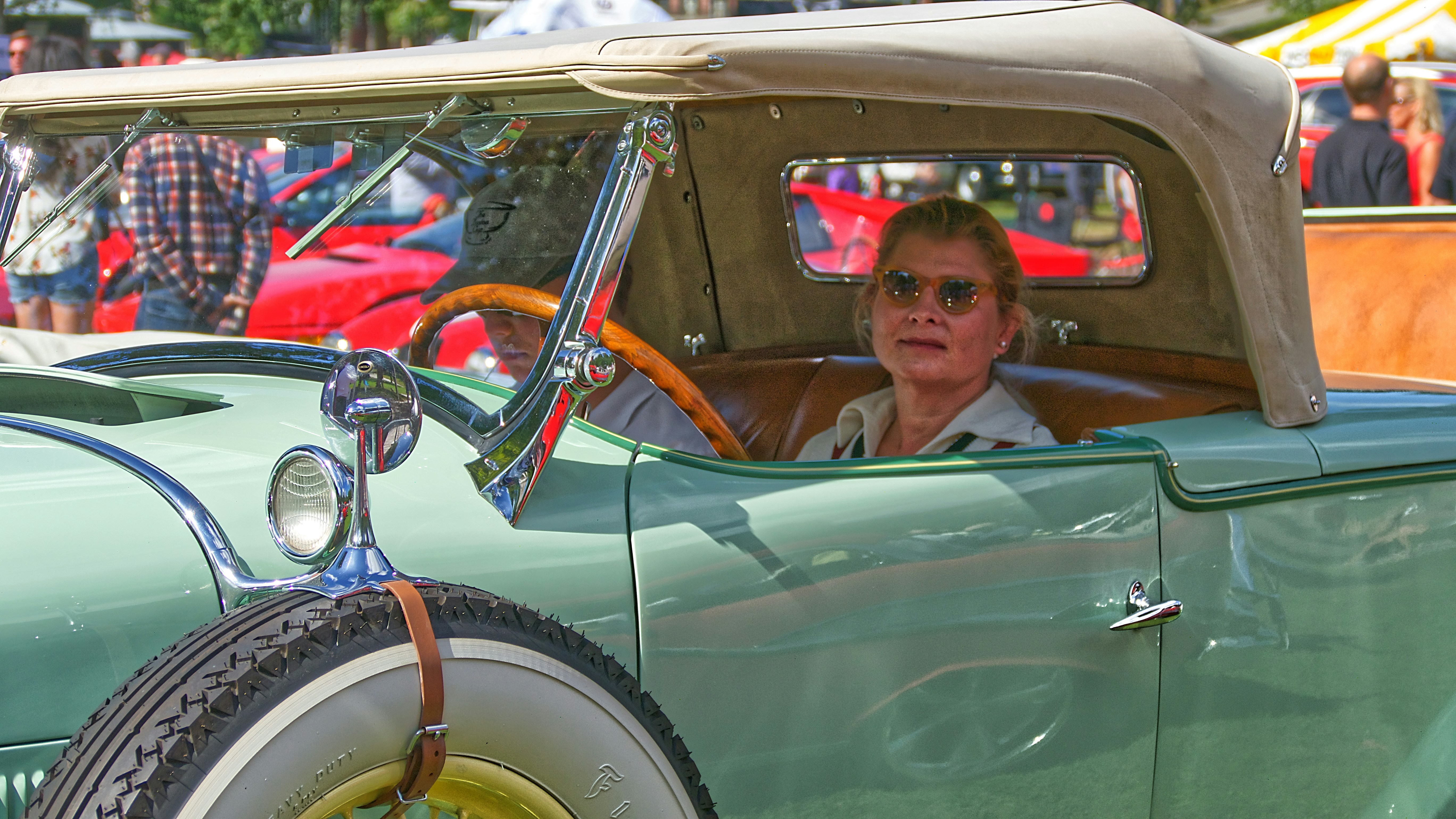 Emerald Vintage: A Glimpse of Grace Behind the Convertible