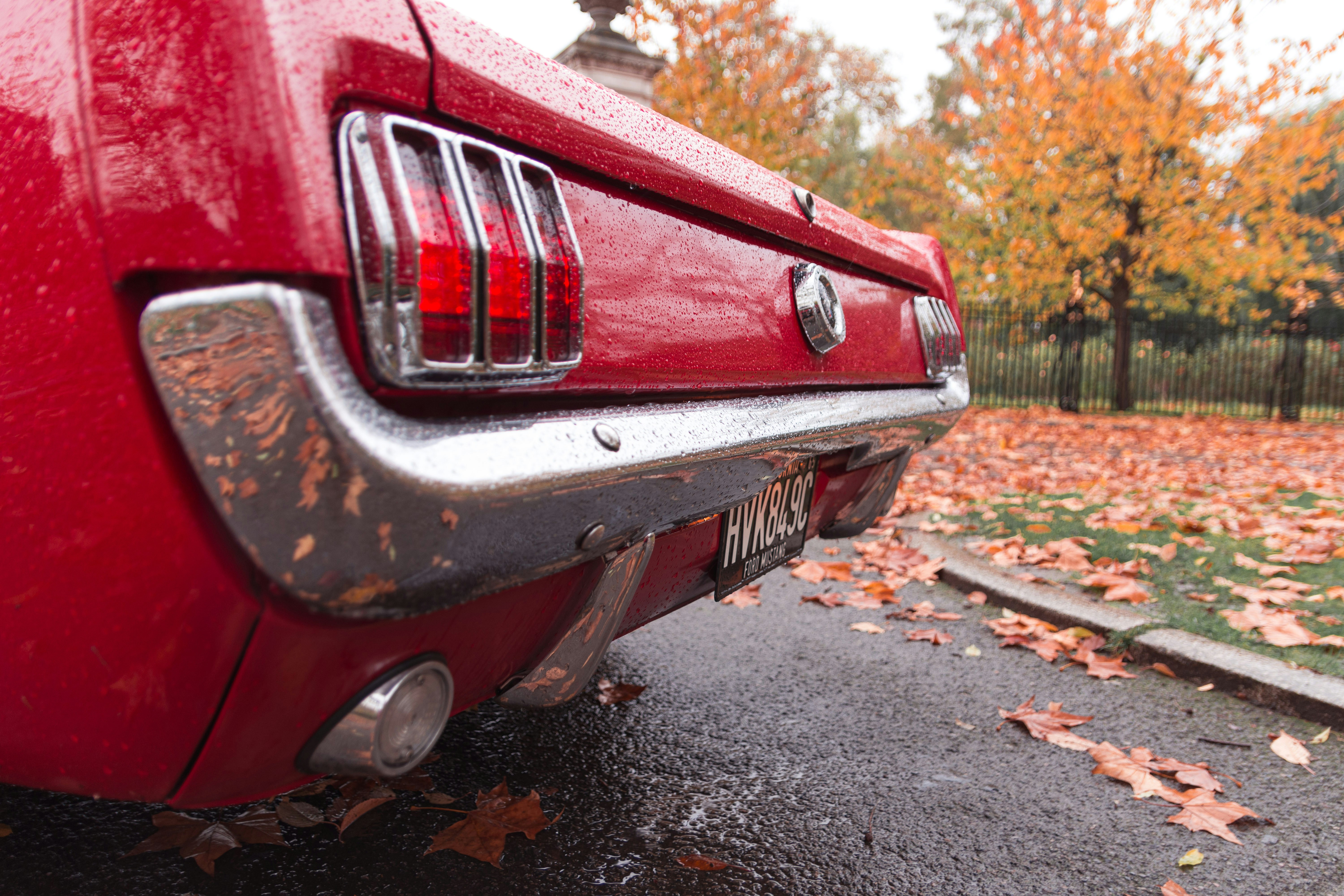 Selective focus photography of parked vintage red car during daytime ...