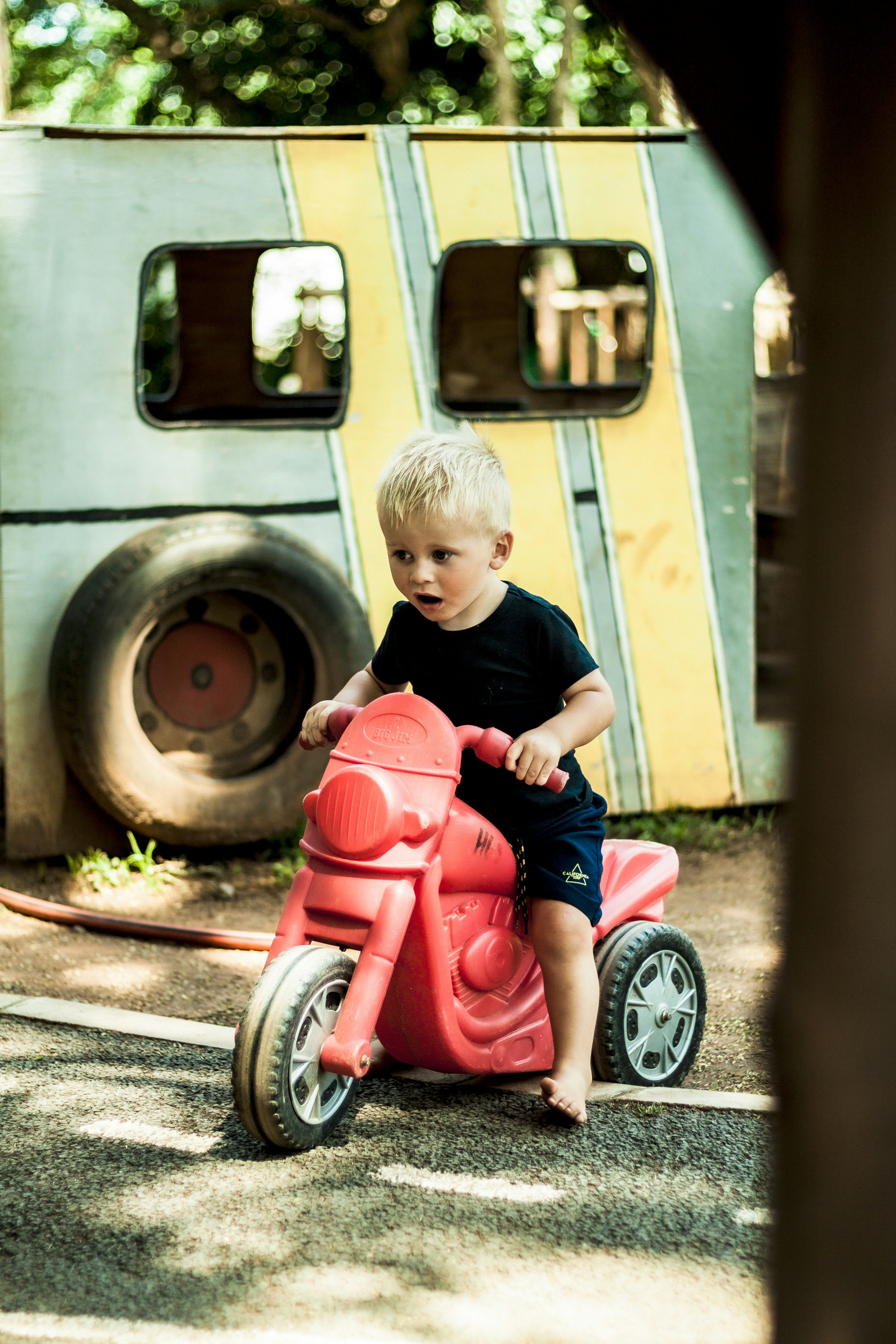 Red Trike, Bright Day: A Toddler's Quiet Outdoor Ride
