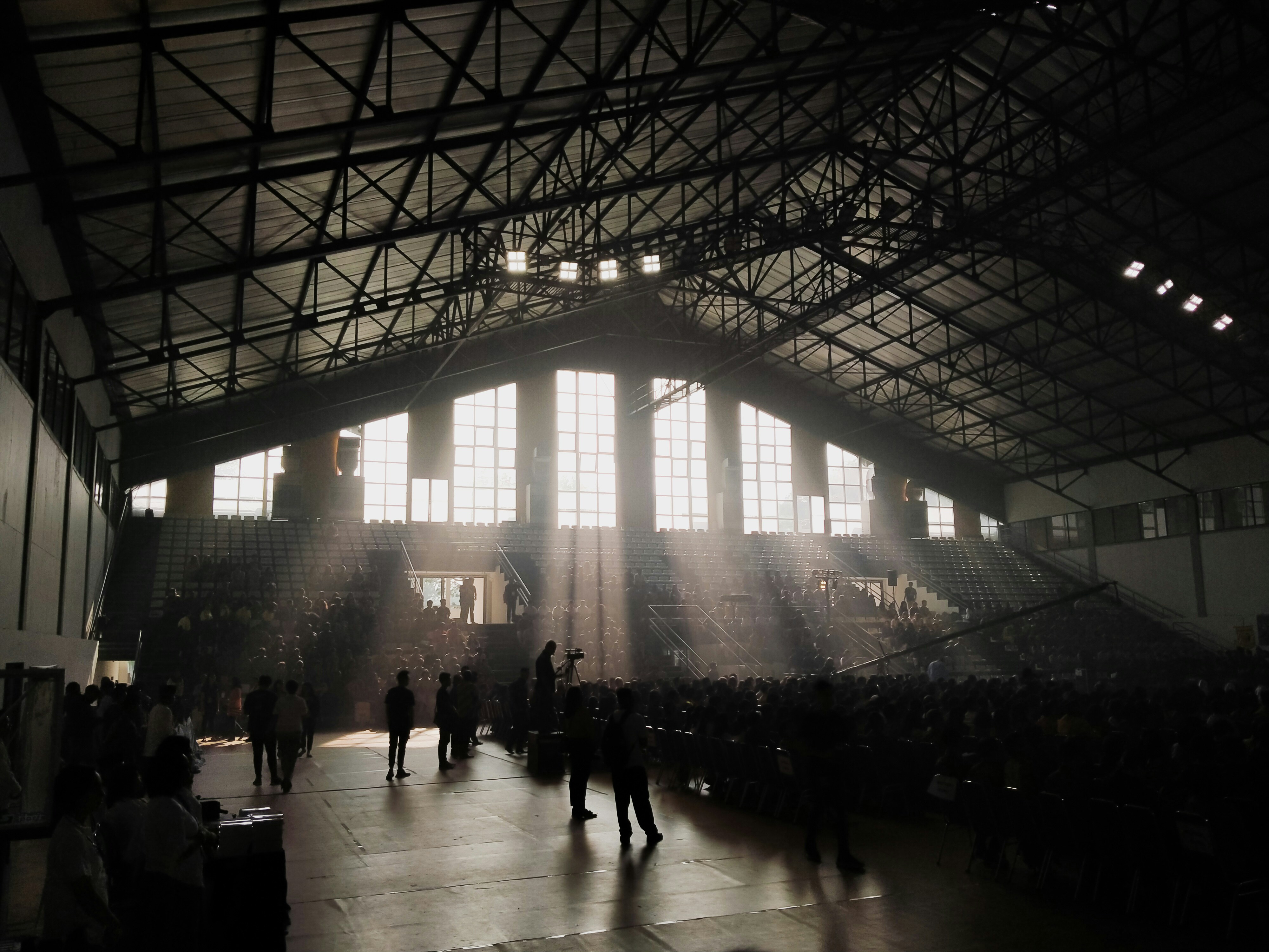 A photograph of a hall with crepuscular rays. This photo was taken during a Eucharist celebration on 17 January 2020 in Jakarta.
