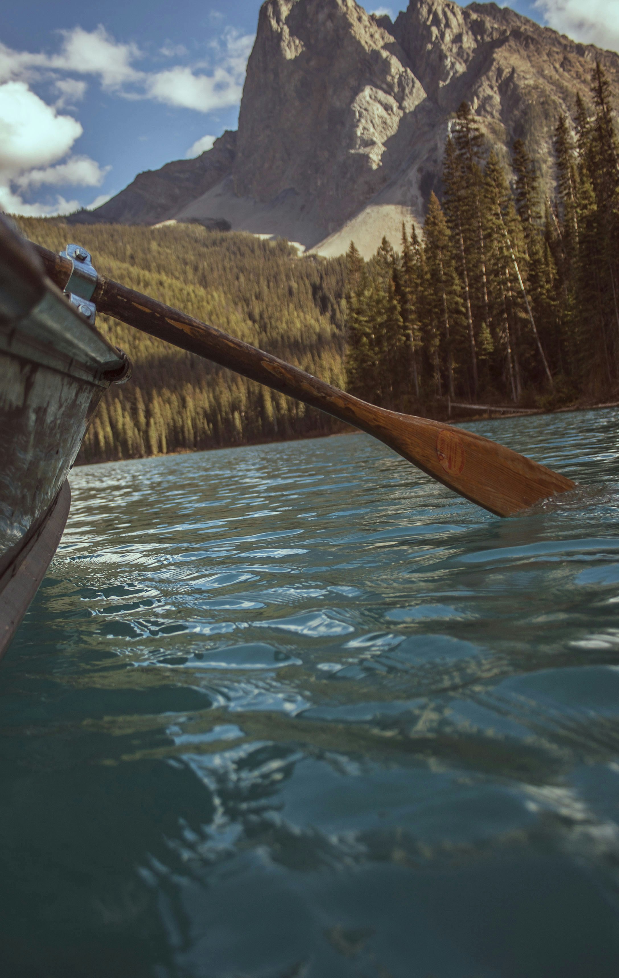 Brown boat on body of water during daytime photo – Free Emerald lake ...