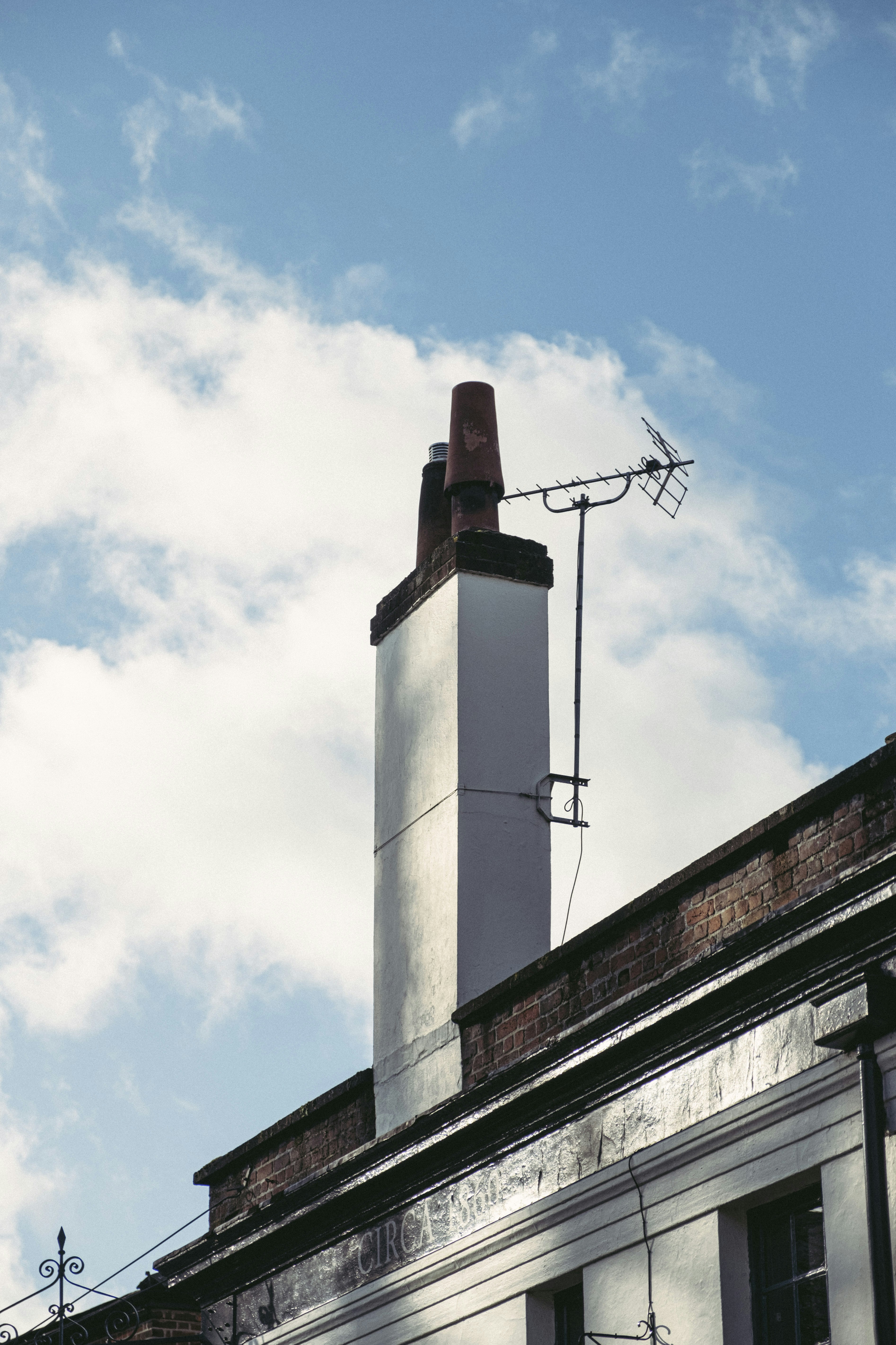 Chimney Sentinel Under a Wide Sky