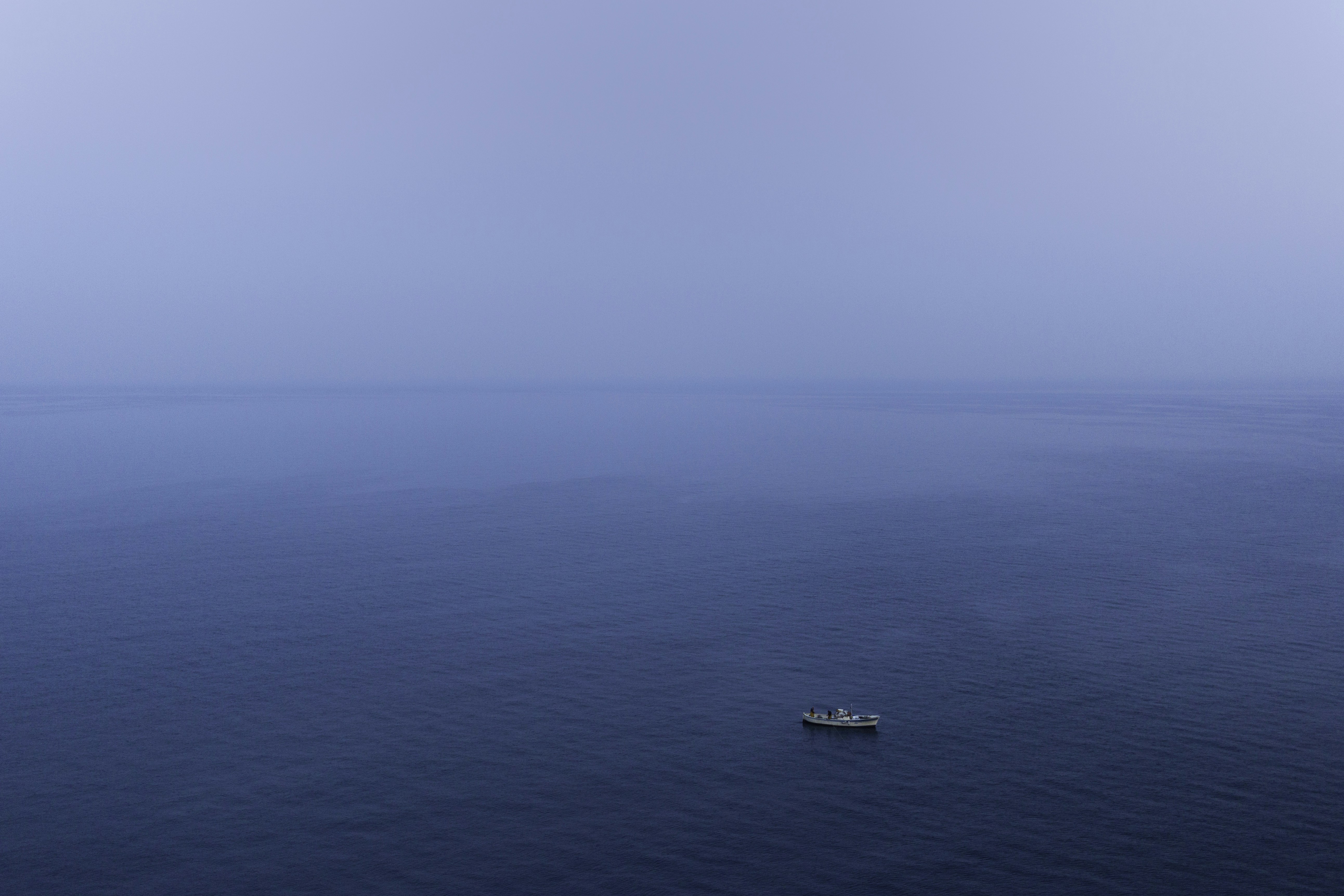 Solitary Voyage at Dawn's Embrace
