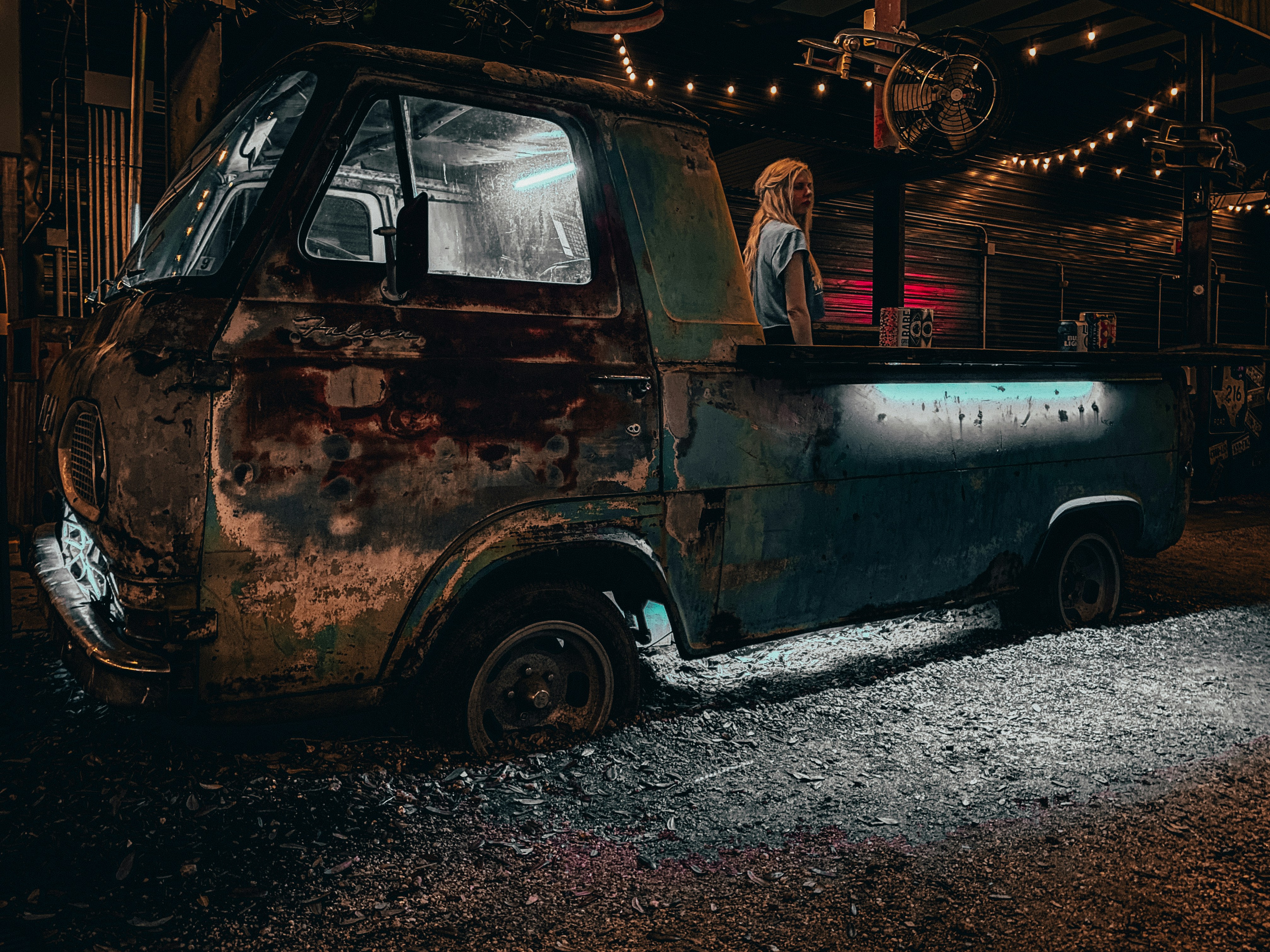 Rust, Snow, and Soft Light: A solitary figure by a weathered van