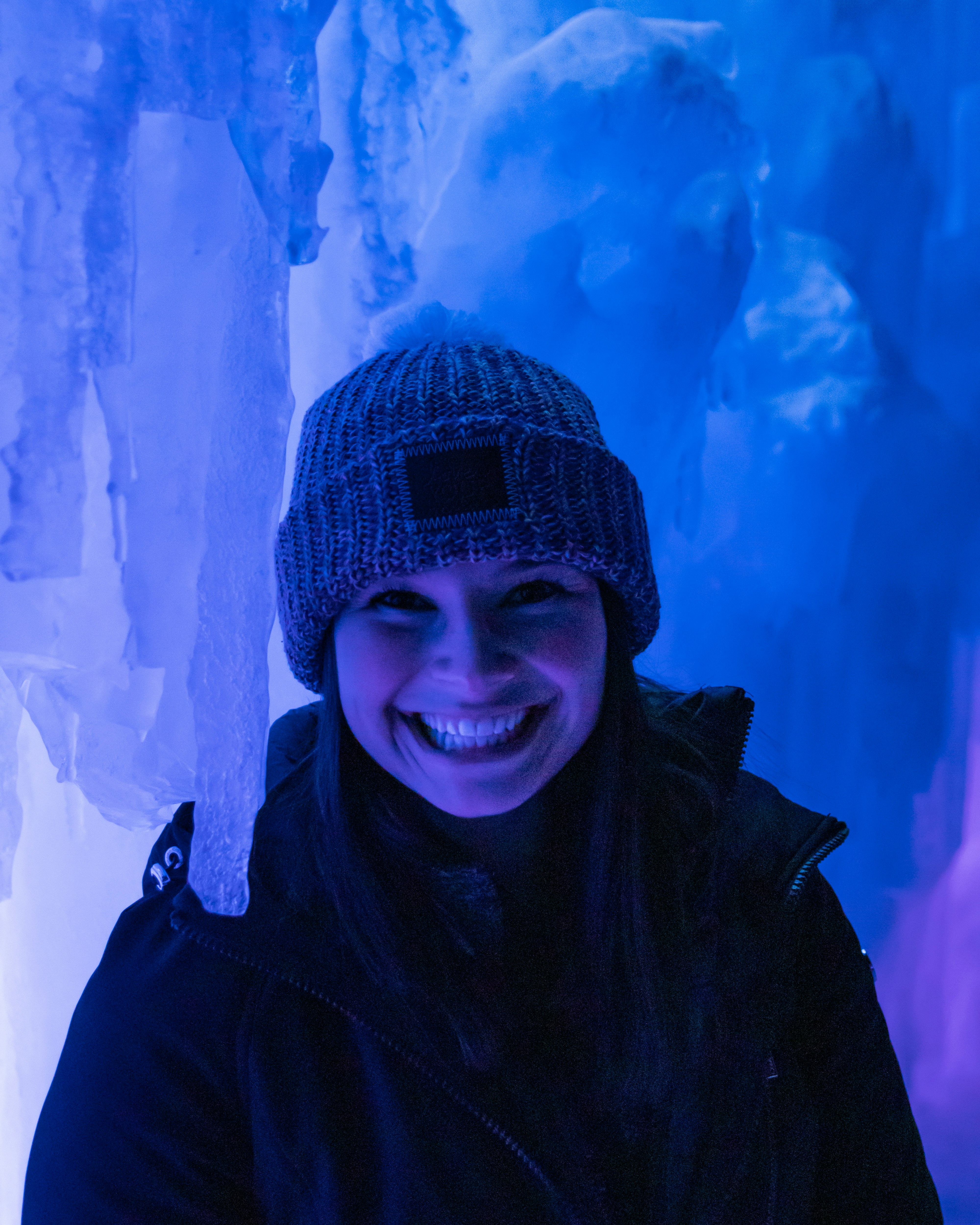 A woman standing in front of ice formations photo – Free Blue Image on ...