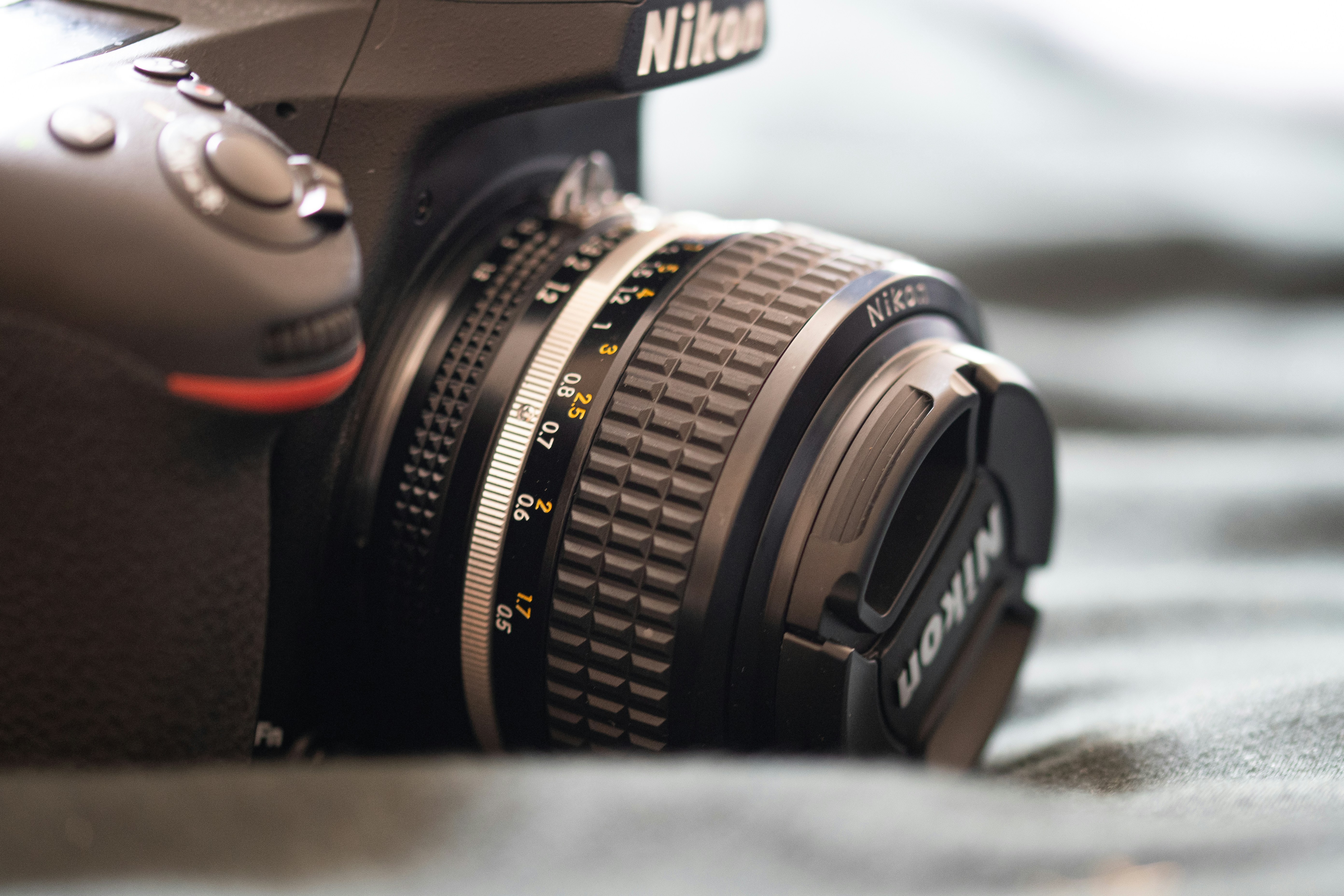 Black nikon dslr camera on gray concrete floor photo – Free Computer ...