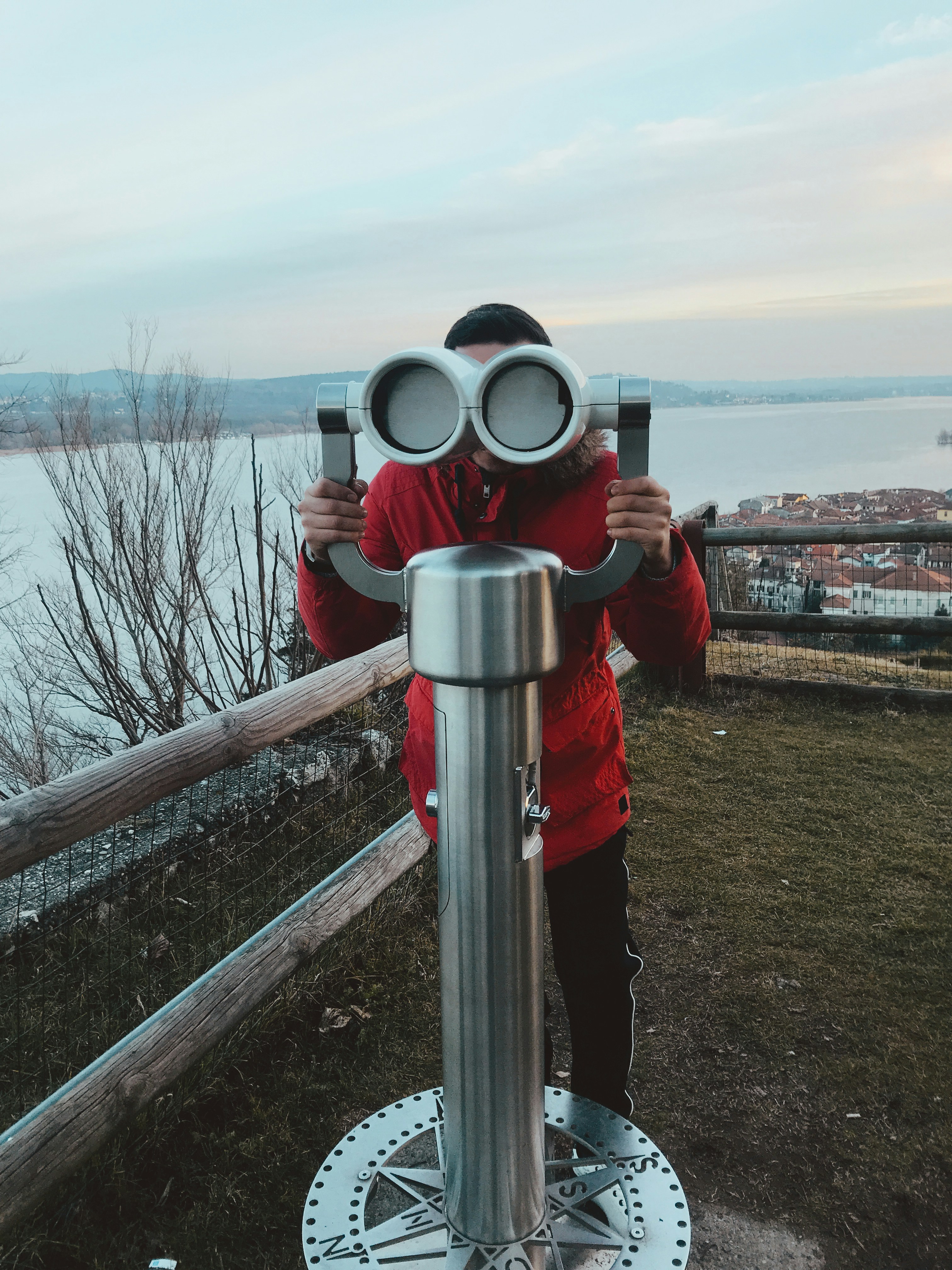 Twin Eyes on the Horizon: A Red-Jacket Moment at the Cliffside Lookout