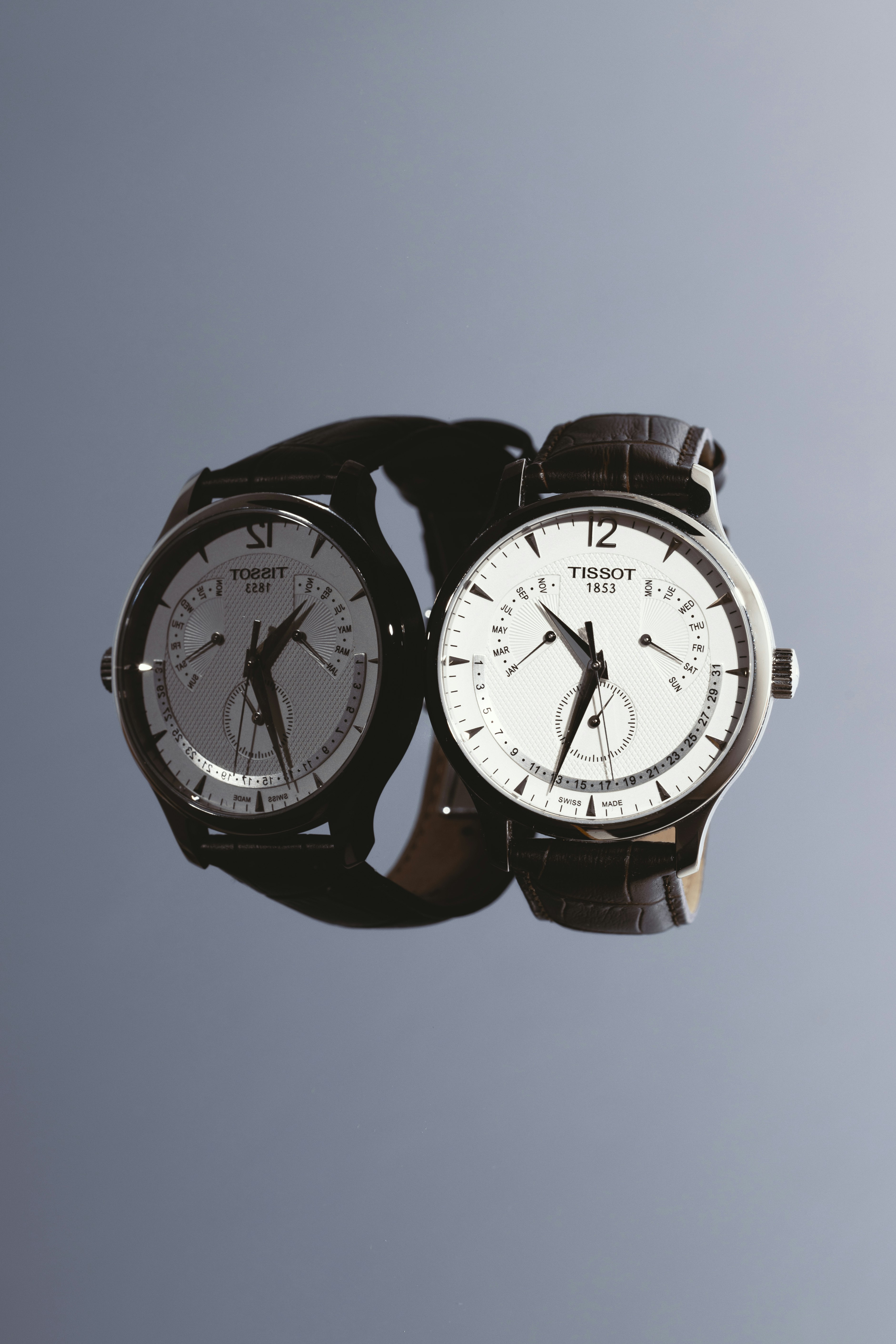 A couple of watches hanging from the side of a pole photo – Free ...