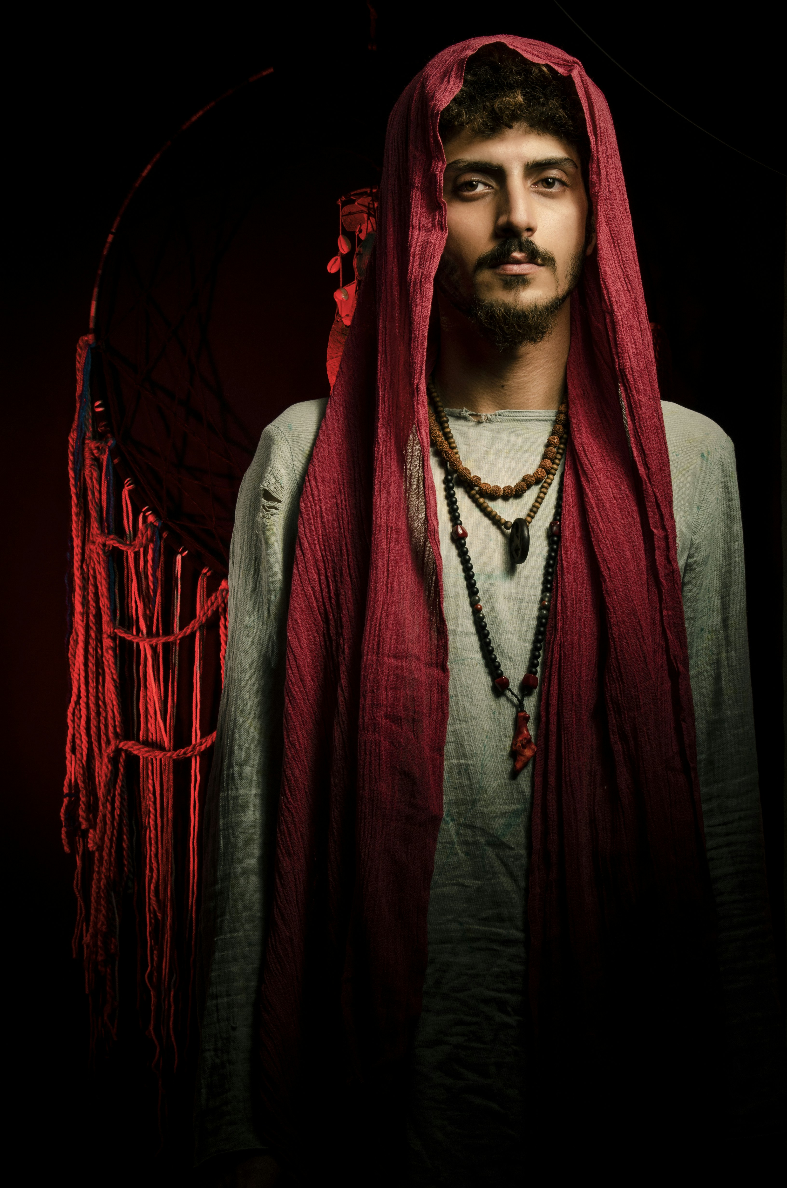 Red Veil Portrait: A Quiet Gaze Through Frayed Threads