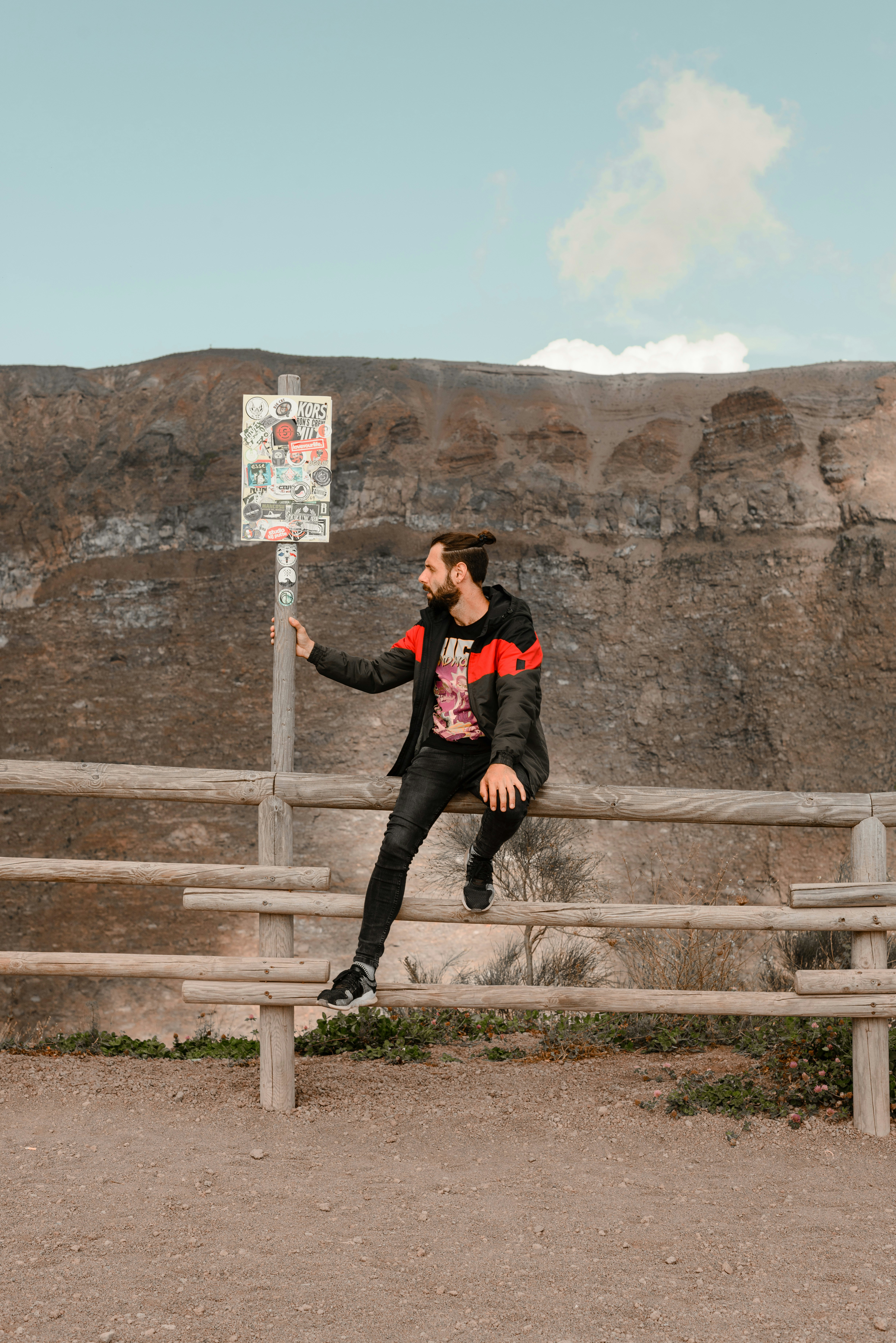 Woman in black jacket and black pants sitting on concrete stairs photo ...